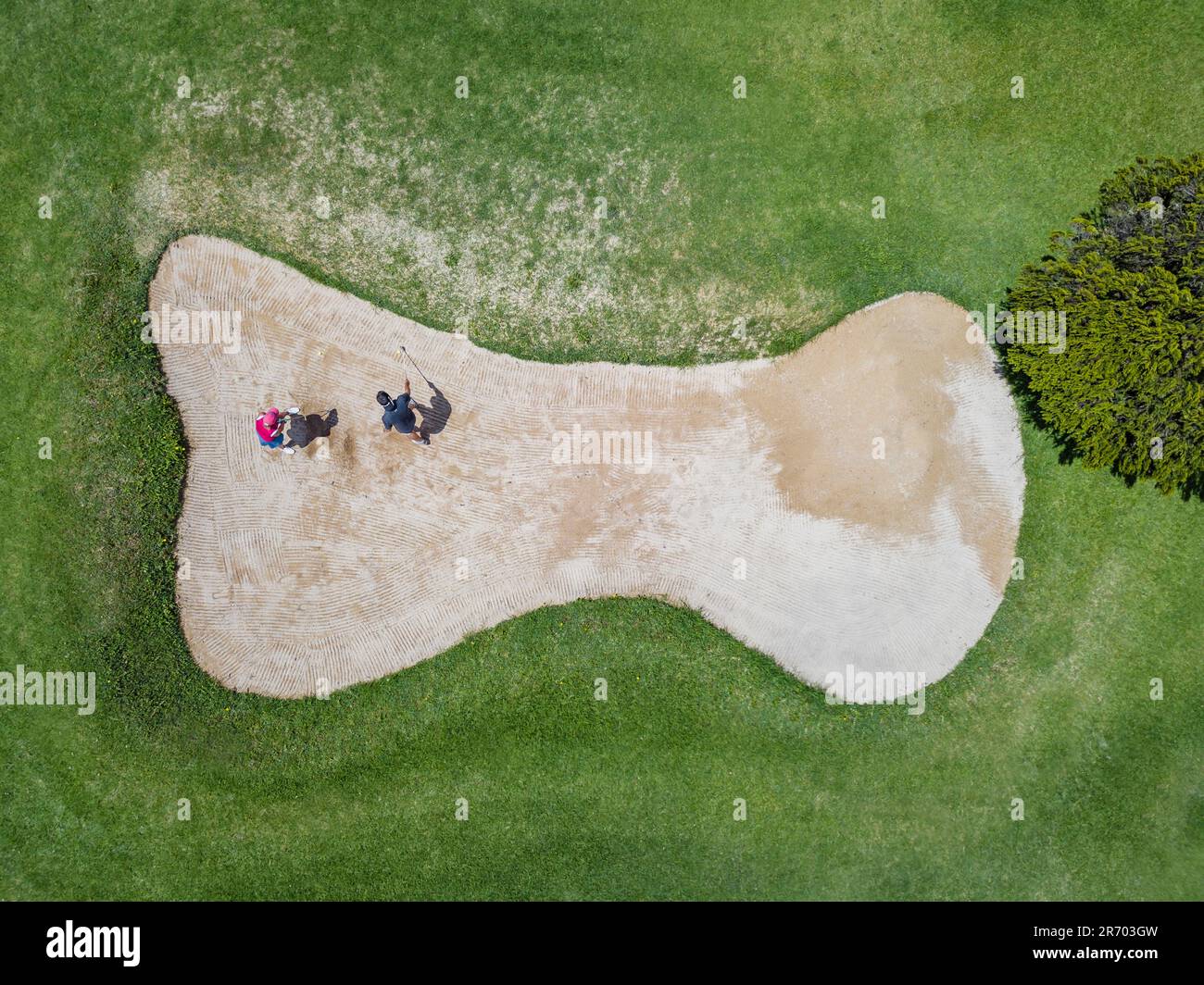 Two golf players in sand trap, Bedugul, Bali, Indonesia Stock Photo - Alamy