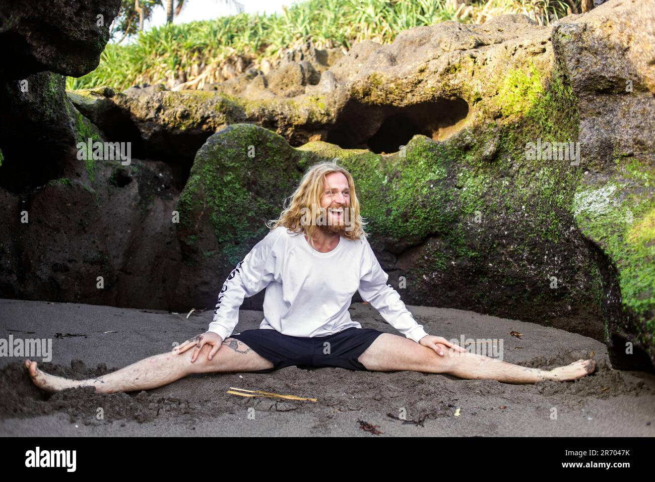 Man doing splits, Canggu, Bali, Indonesia Stock Photo - Alamy