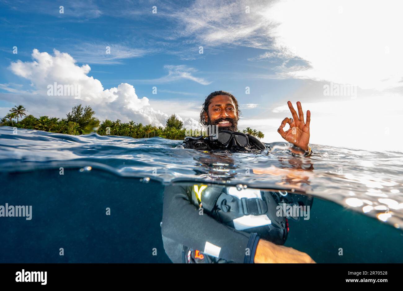 diver floating on the surface after a dive in the Maldives Stock Photo ...