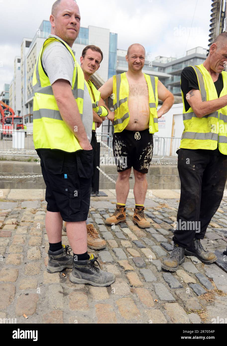 Irish construction workers working at a sight of a new building along ...