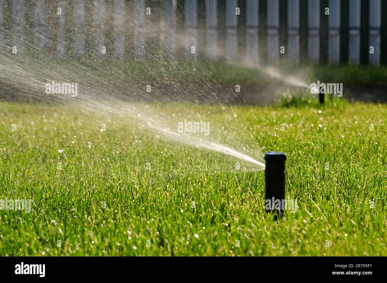 Automatic garden irrigation system watering lawn with adjustable head ...