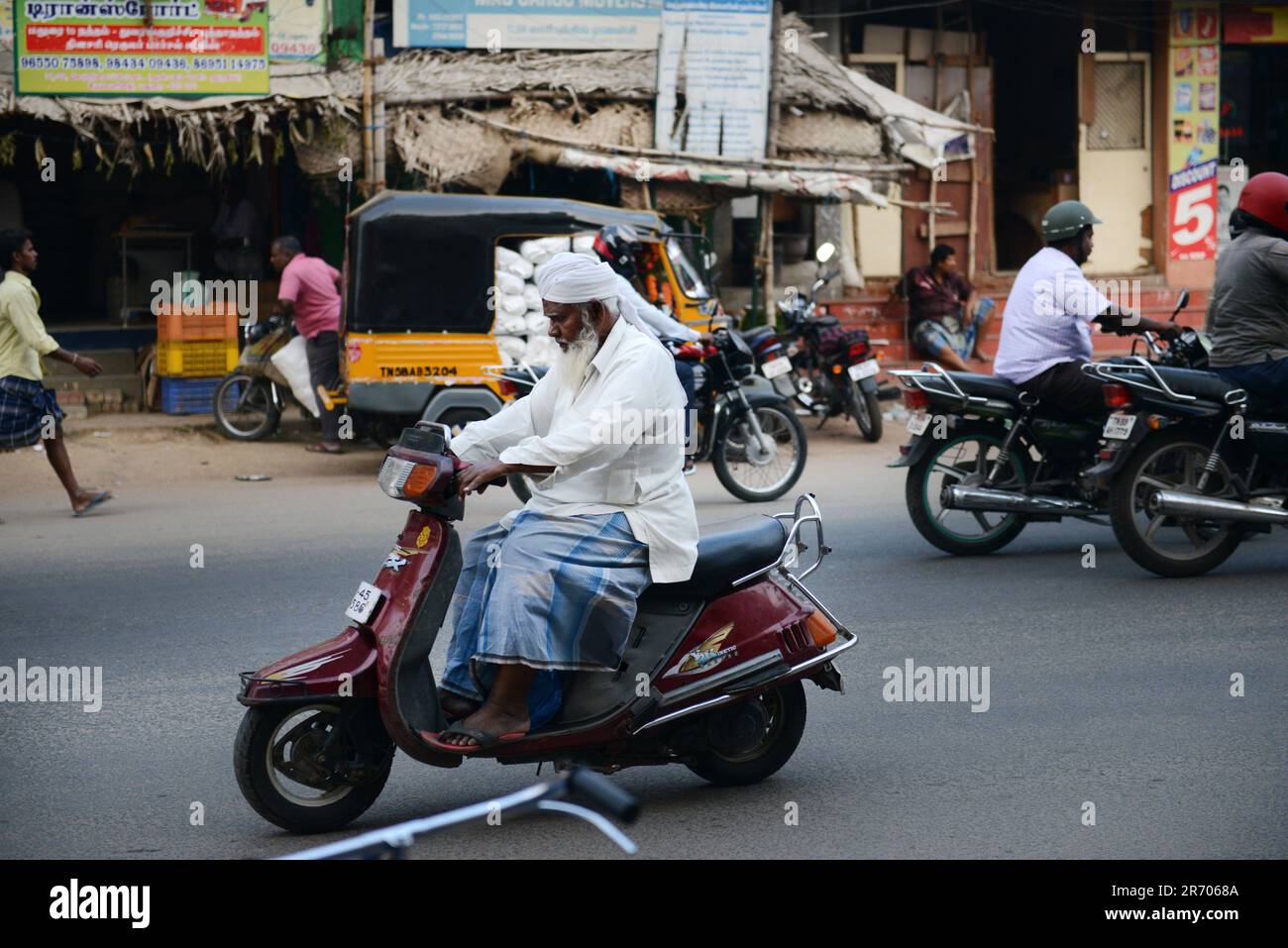 A Tamil man riding his scooter in Madurai, India Stock Photo - Alamy