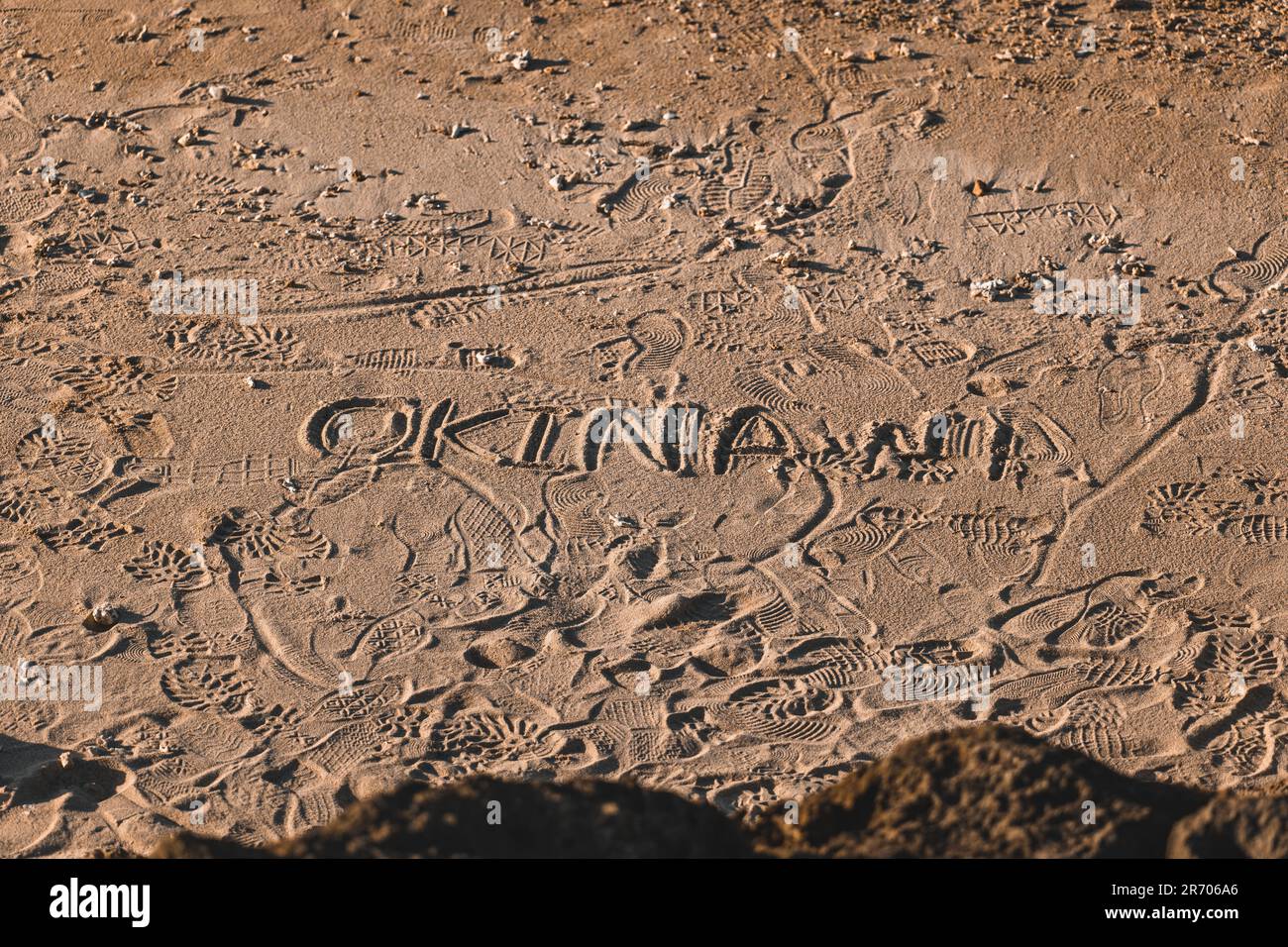 The word Okinawa on the sand of a beach Stock Photo - Alamy