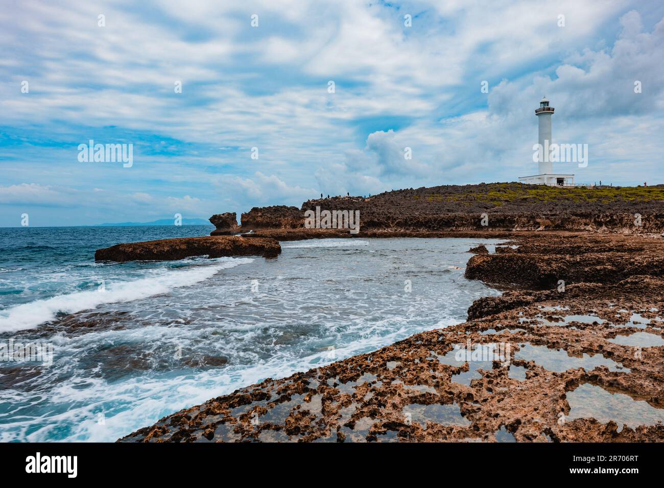 A picturesque view of the Cape Zanpa Lighthouse situated along the ...