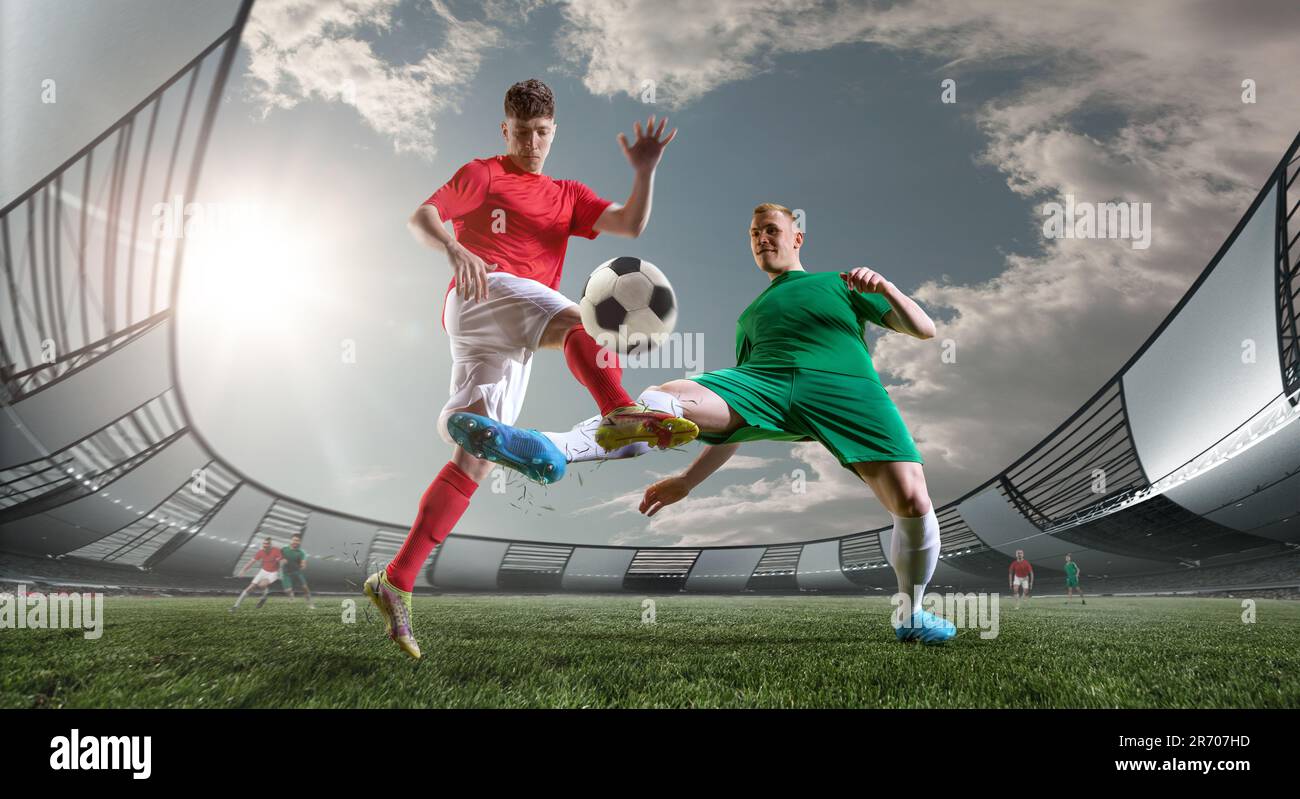 Dynamic image of two competitive men, football players in motions ...