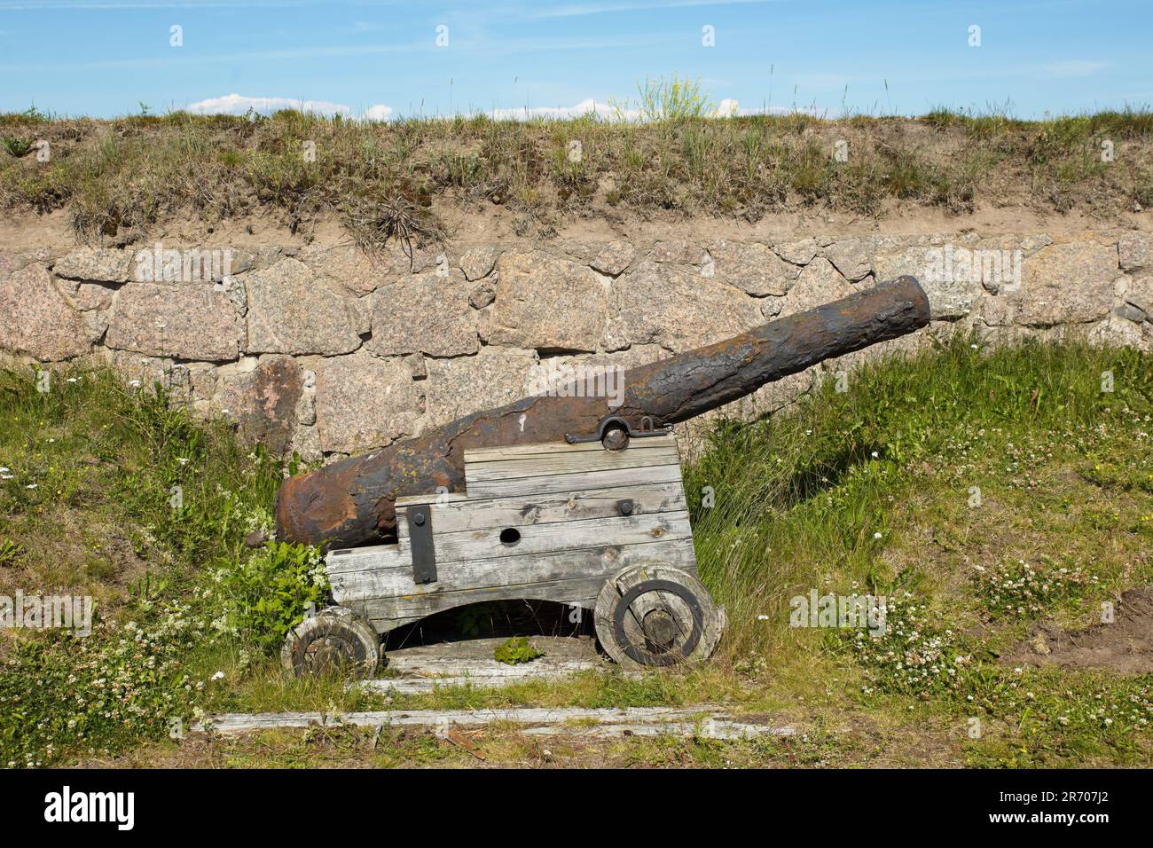 Old classic canon with wheels in stone fortress Stock Photo - Alamy