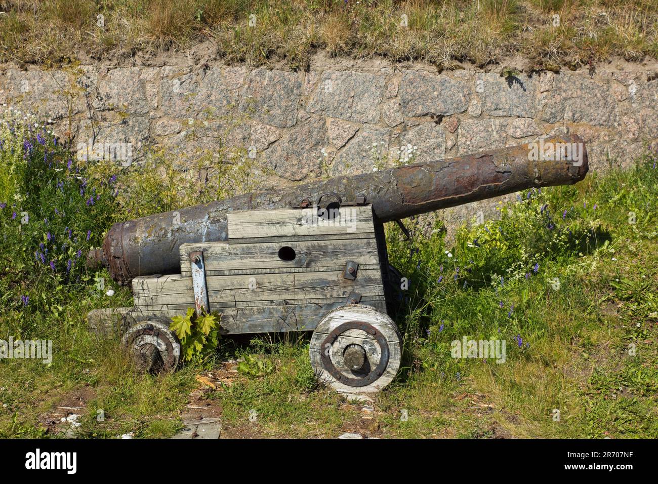 Old classic canon with wheels in stone fortress Stock Photo - Alamy