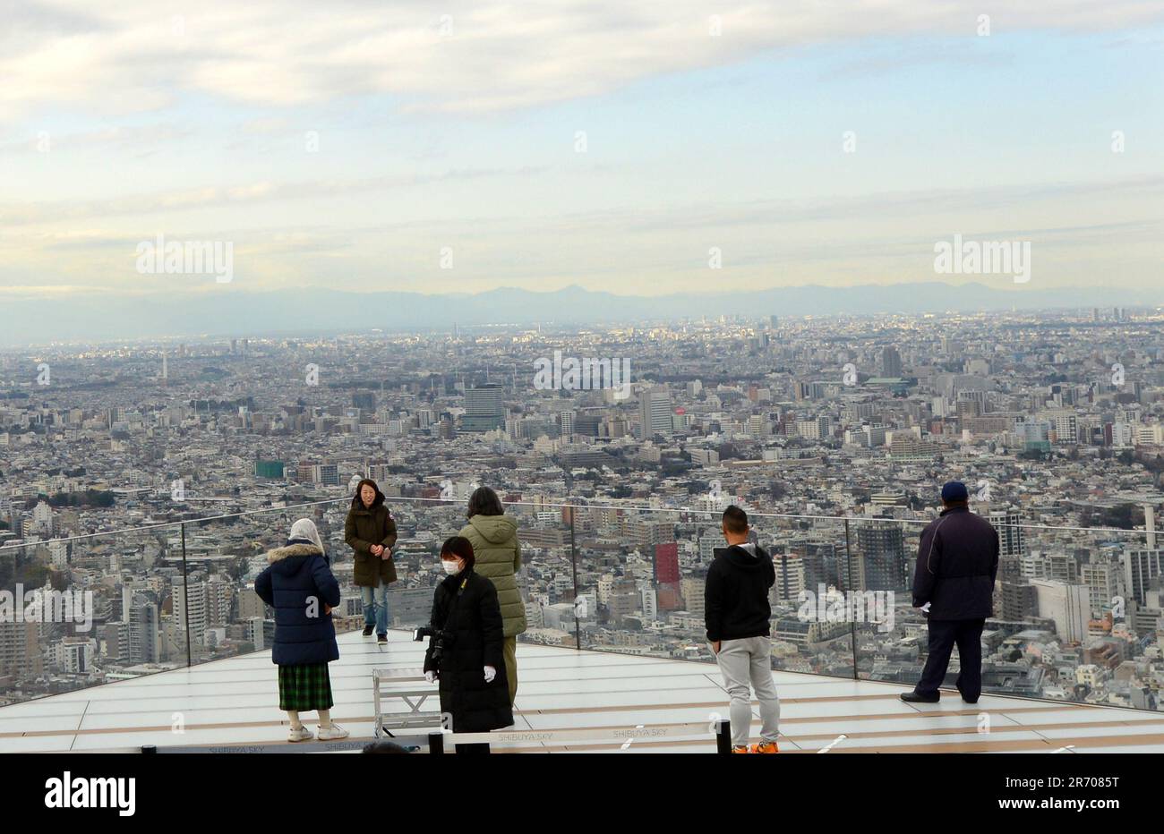 Tourist enjoying the views from the Shibuya Sky rooftop observation ...