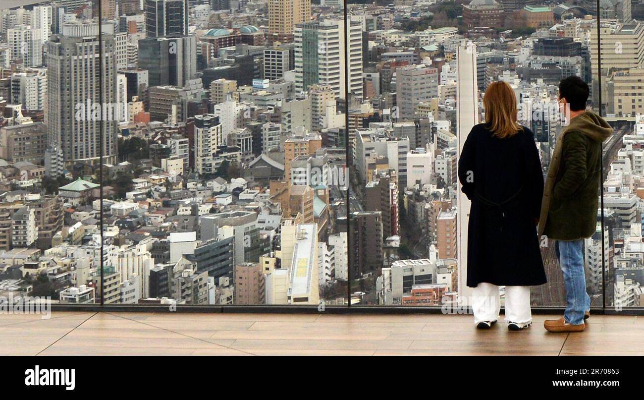 Tourist enjoying the views from the Shibuya Sky rooftop observation ...