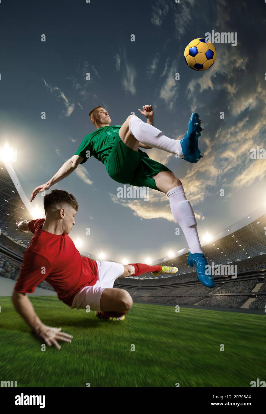 Concentration and winning goal. Two male sportsmen, football players in ...