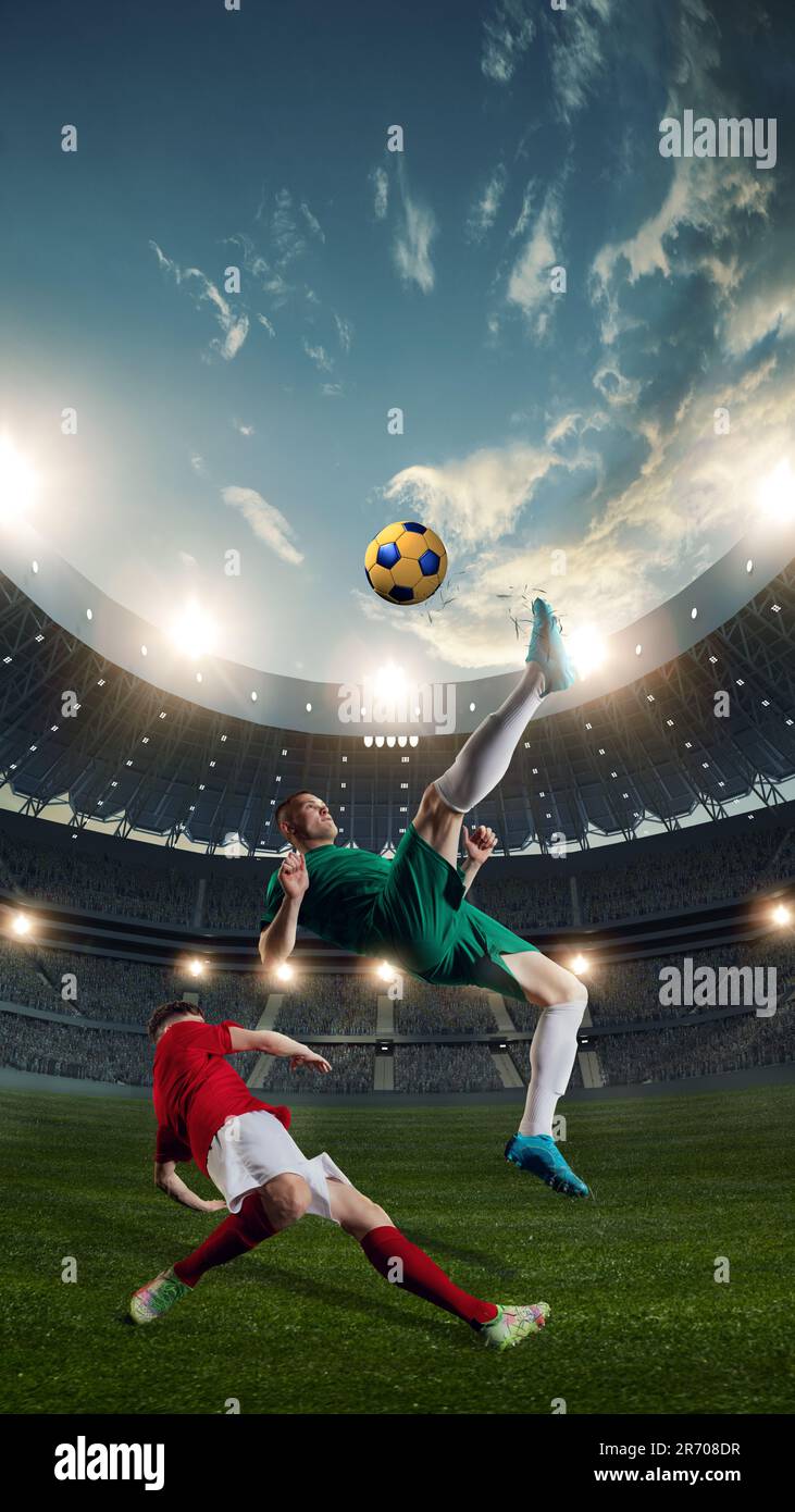 Dynamics. Two male sportsmen, football players in motion during ...