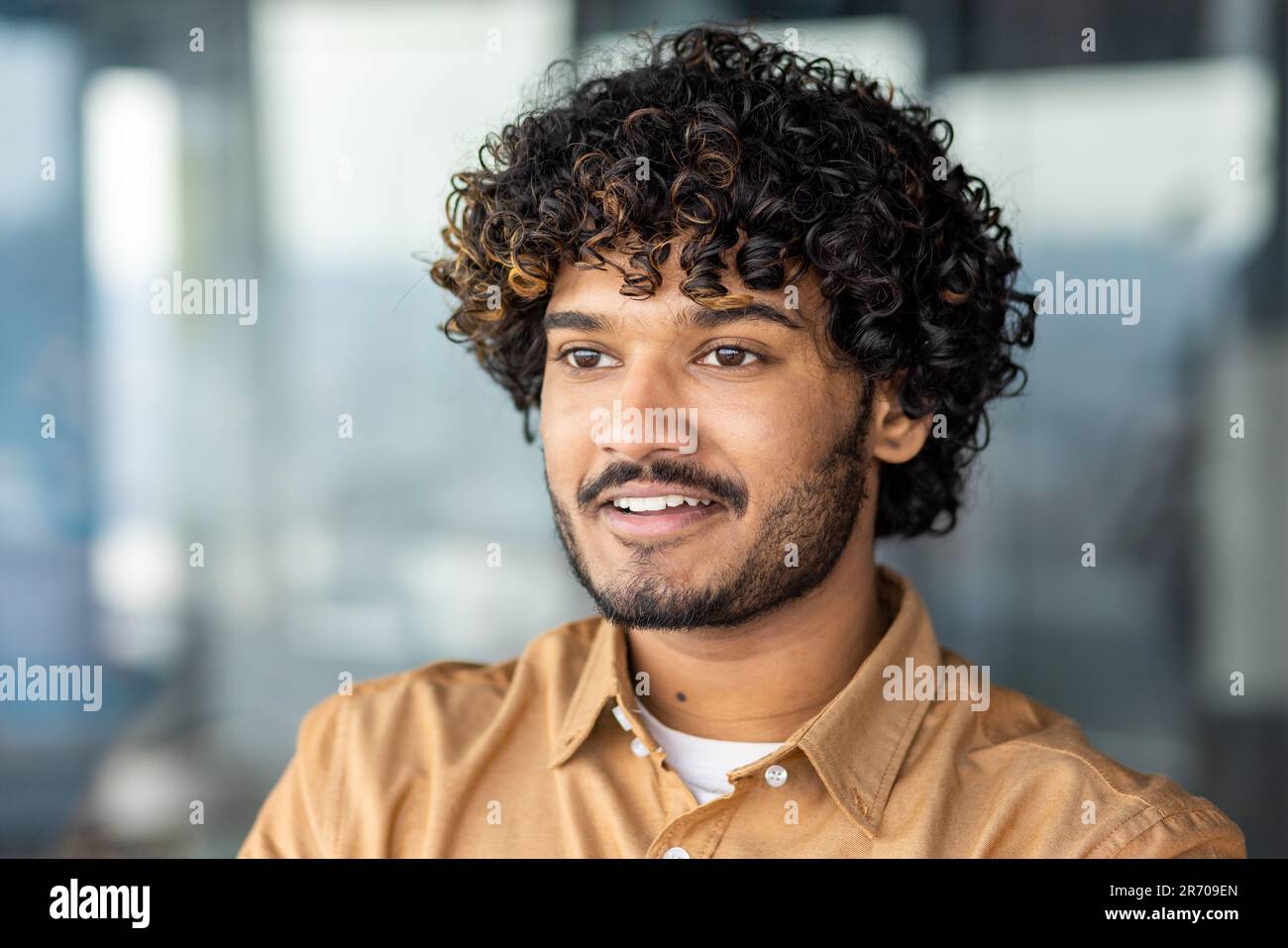 Close up portrait of young Hindu programmer, man in shirt smiling and ...