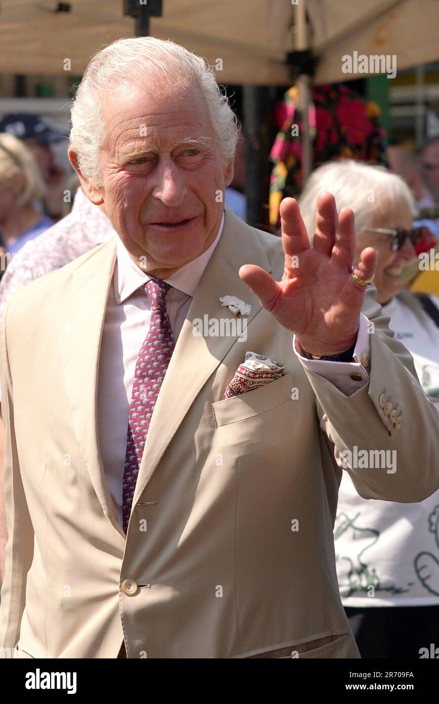 King Charles III waves during a visit to Pickering in Yorkshire, after ...