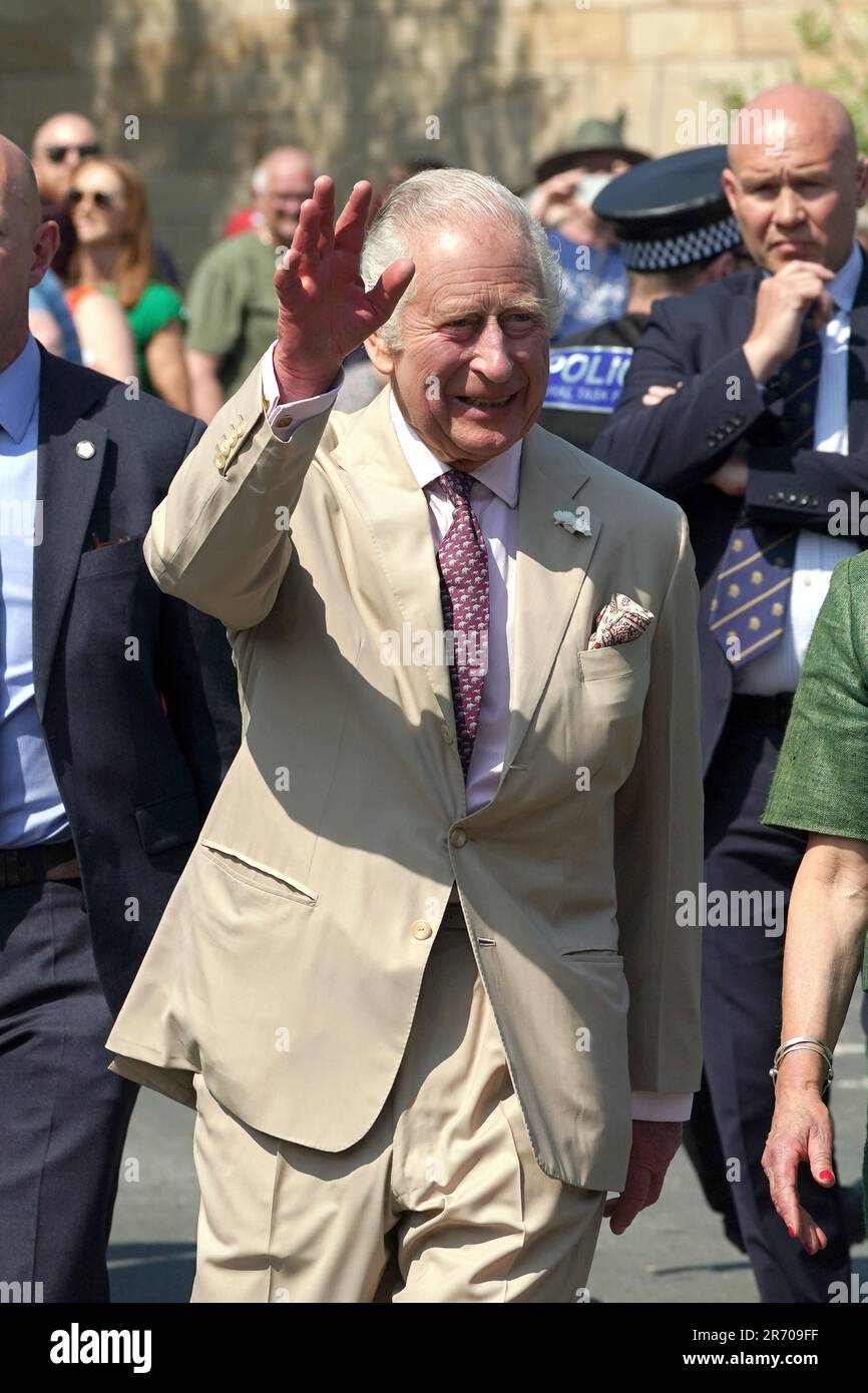 King Charles III waves during a visit to Pickering in Yorkshire, after ...
