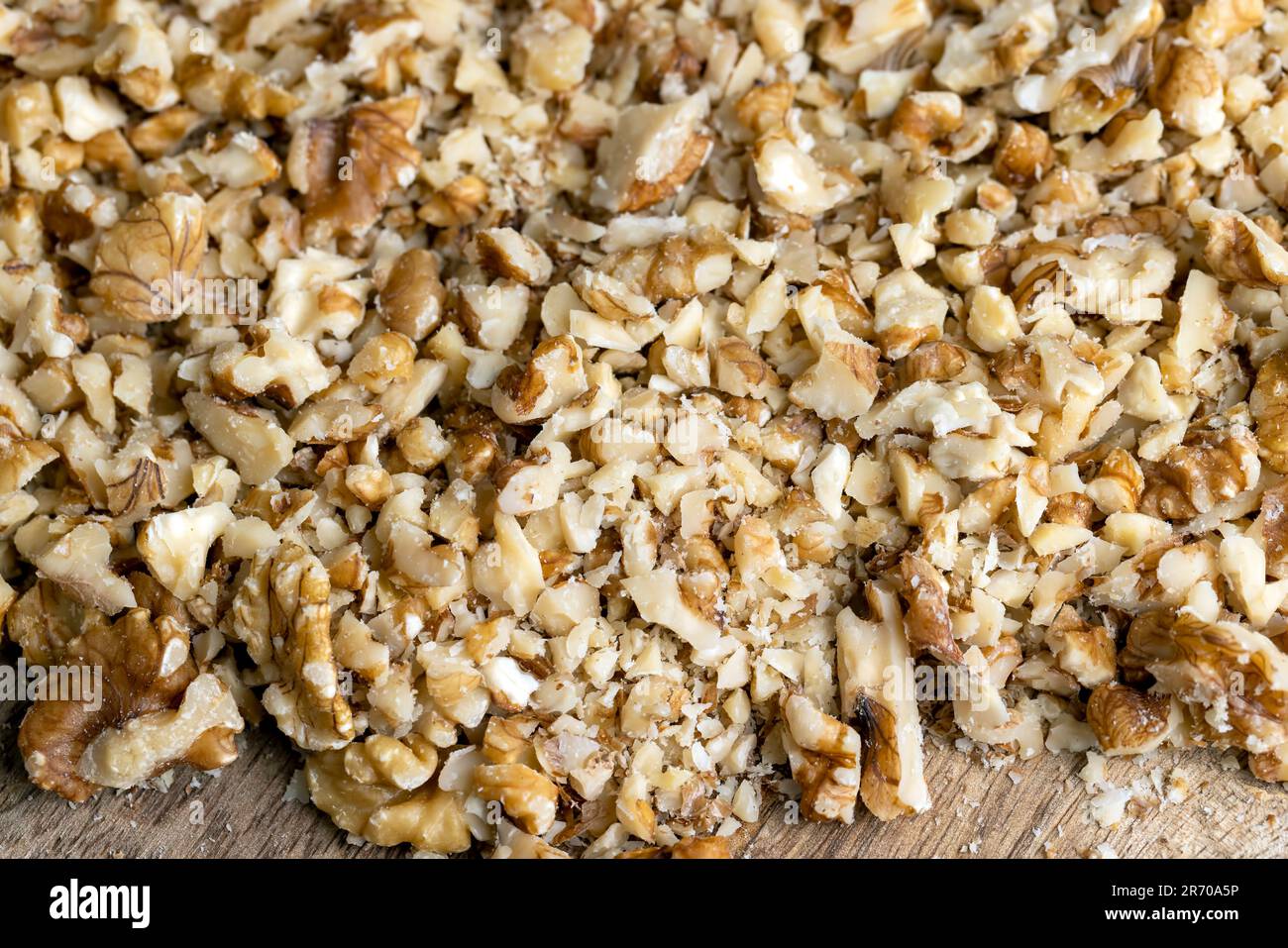 Peeled walnuts, walnut kernel on the kitchen table during cooking Stock ...