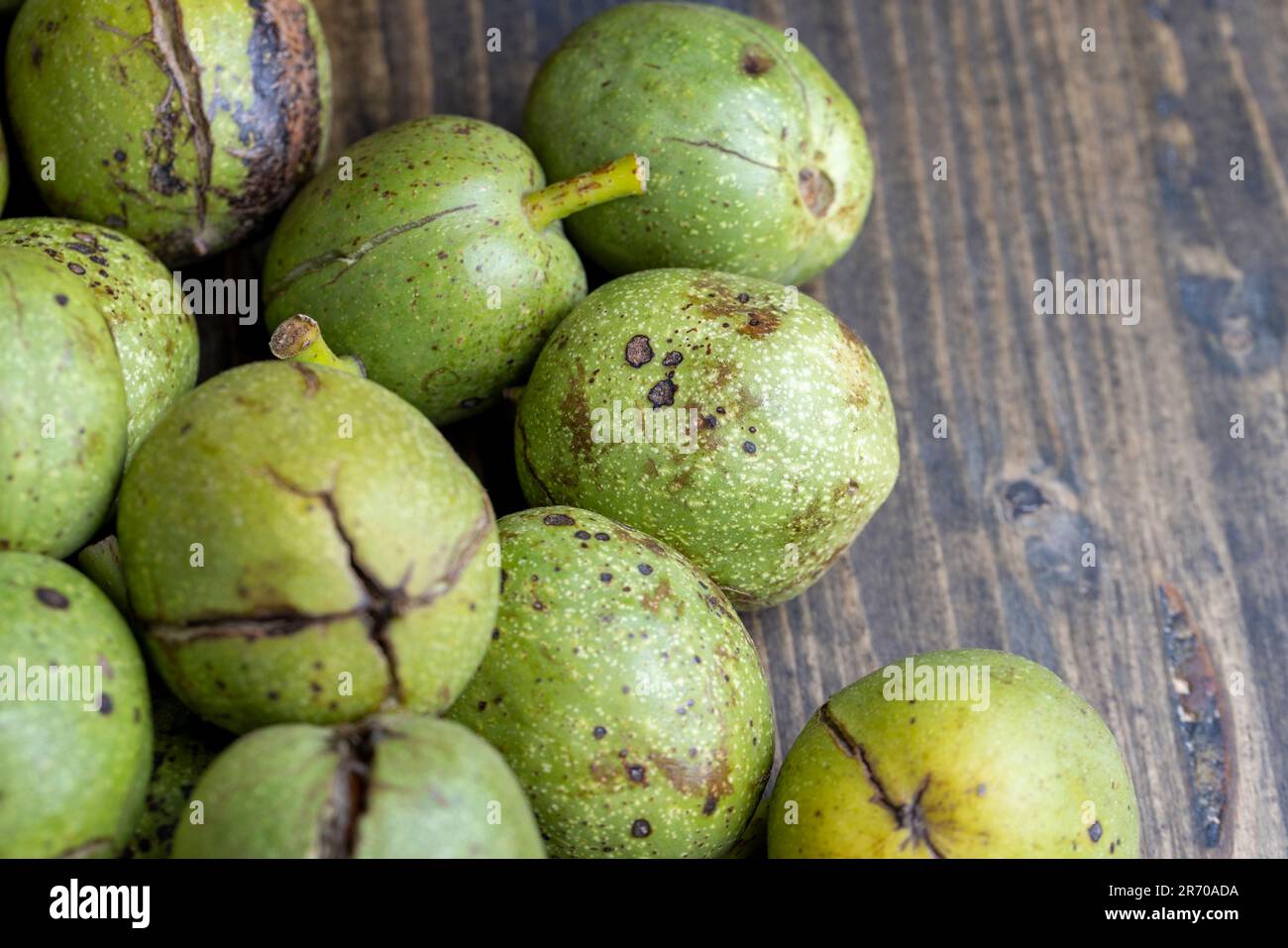 Ripe walnuts with green shells, unpeeled but harvested walnuts Stock ...