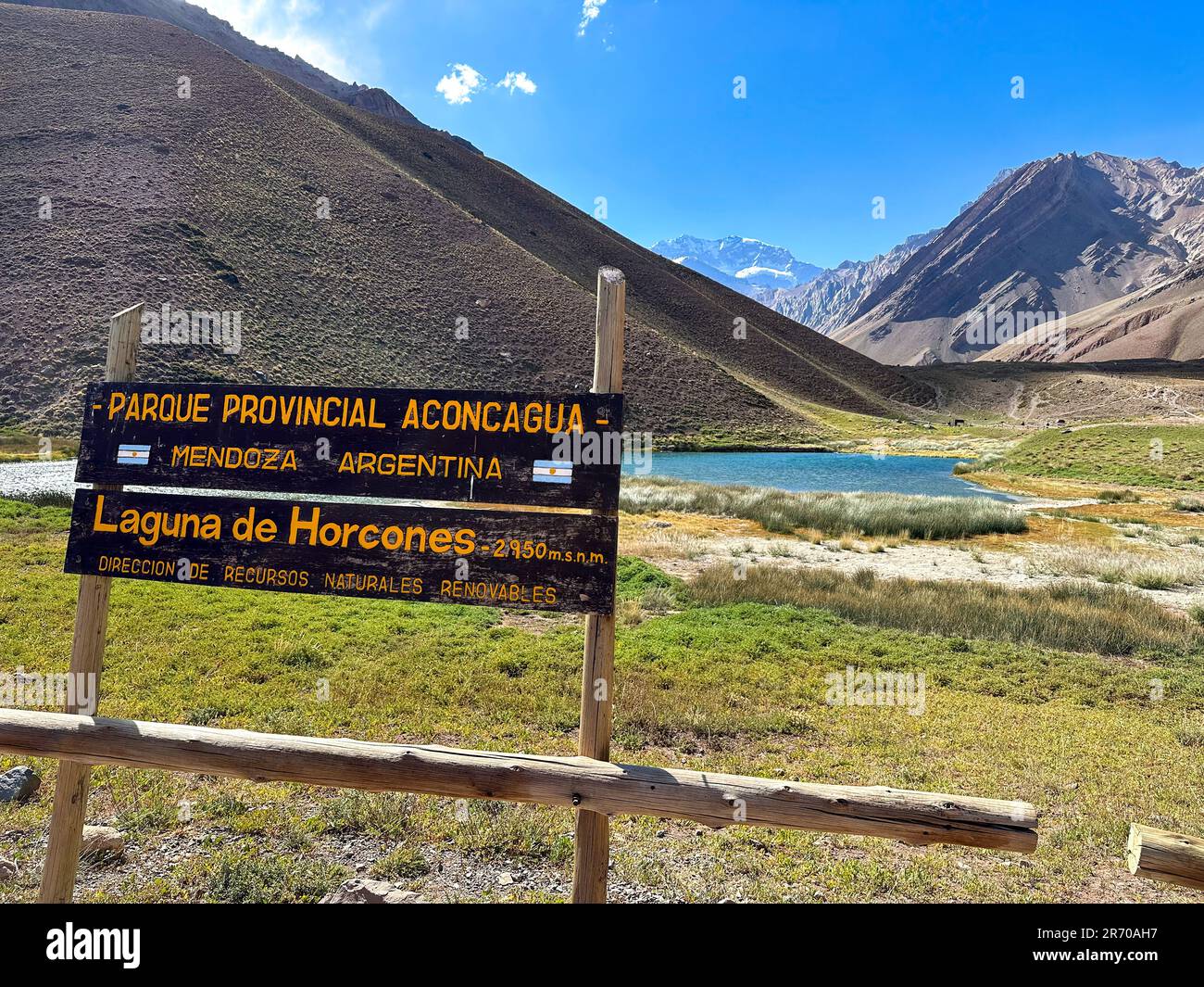 A sign at the Horcones Lagoon with Cerro Aconcagua behind in Aconcagua ...