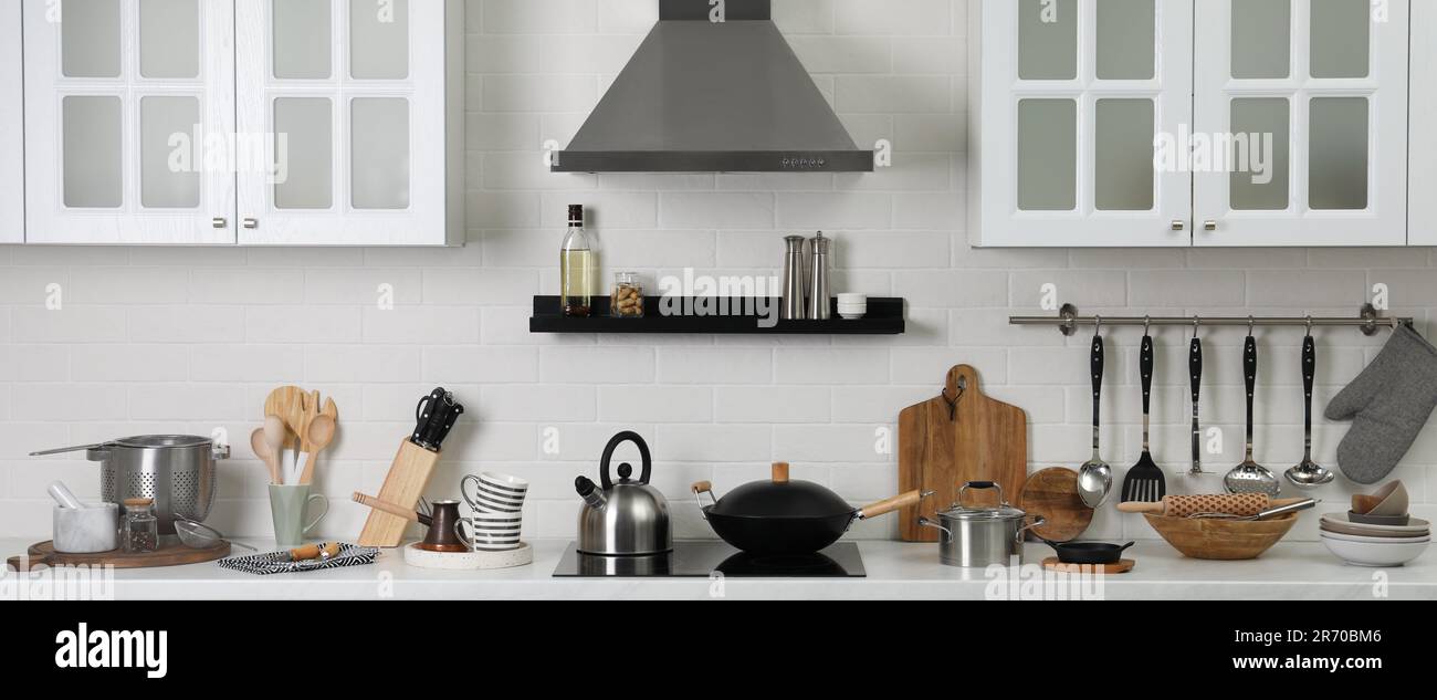 Countertop with different cooking utensils in kitchen, banner design ...
