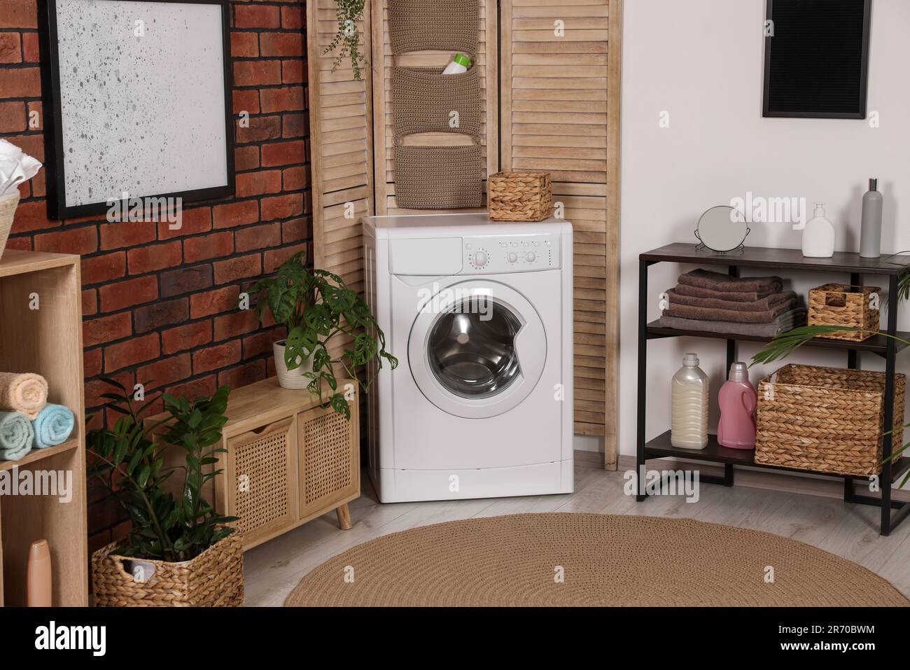Stylish laundry room with washing machine. Interior design Stock Photo ...