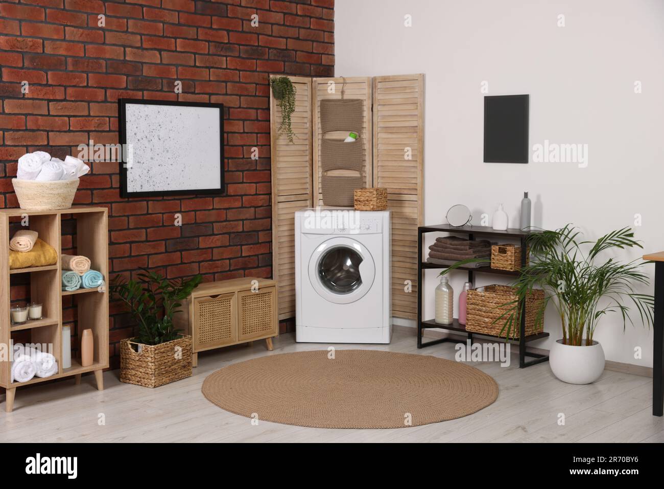 Stylish laundry room with washing machine. Interior design Stock Photo ...