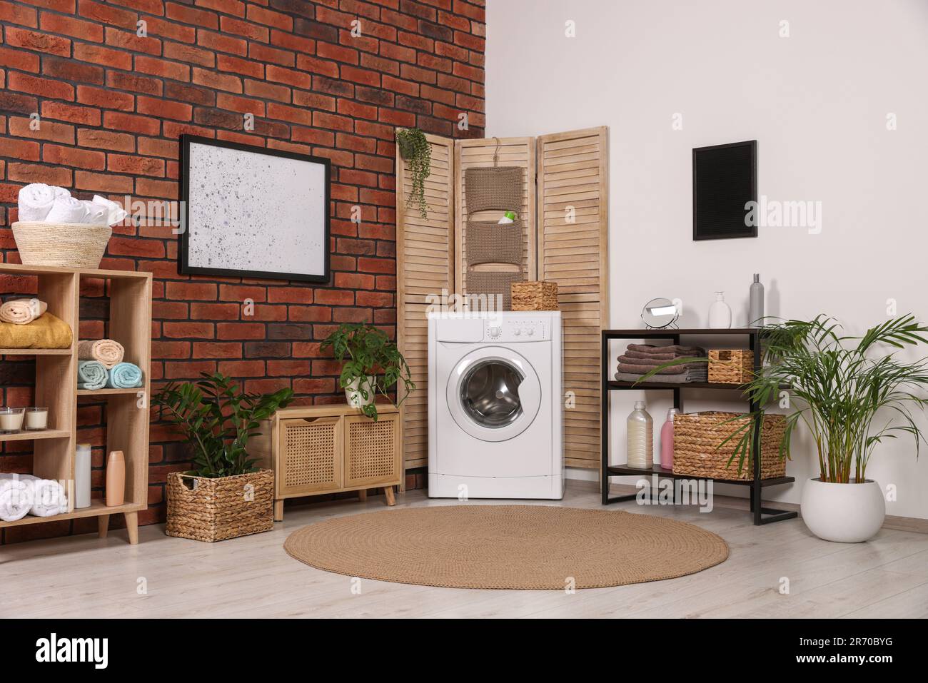 Stylish laundry room with washing machine. Interior design Stock Photo ...