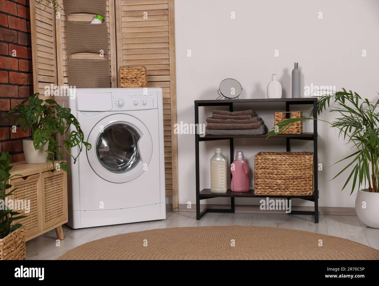 Stylish laundry room with washing machine. Interior design Stock Photo ...