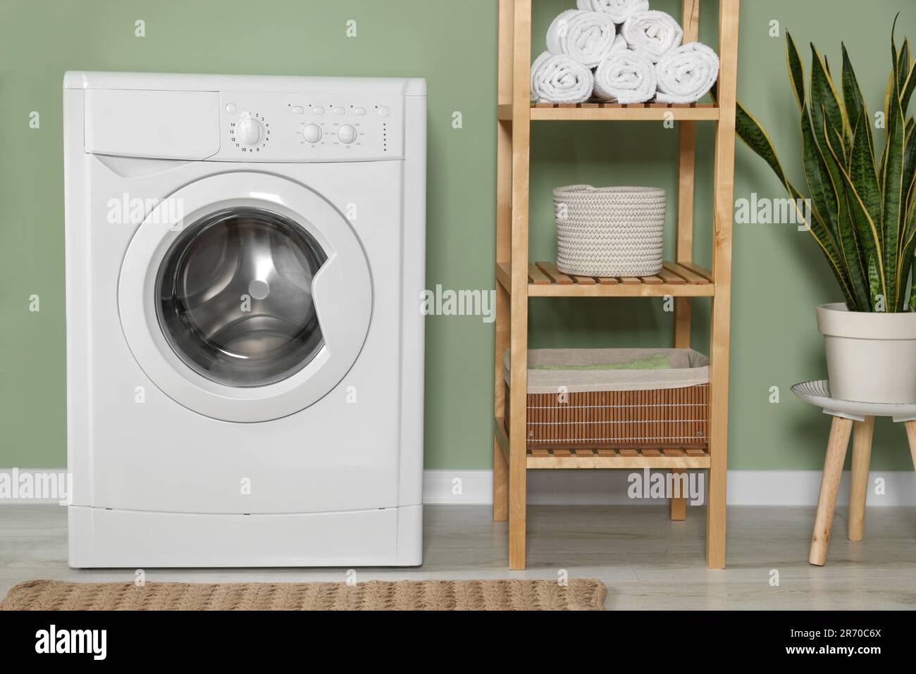 Stylish laundry room with washing machine. Interior design Stock Photo ...