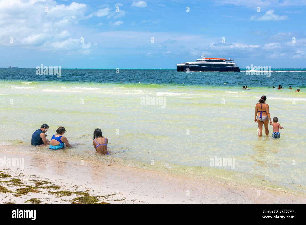 XCaret ferry boat from Isla Mujeres with people swimming in sea, Cancun ...