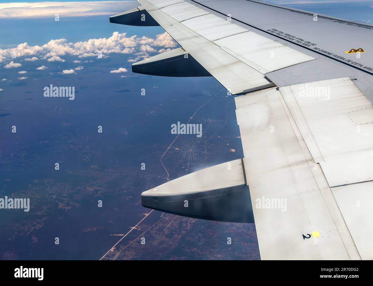 Oblique angle aerial view through plane window over Yucatan peninsula ...