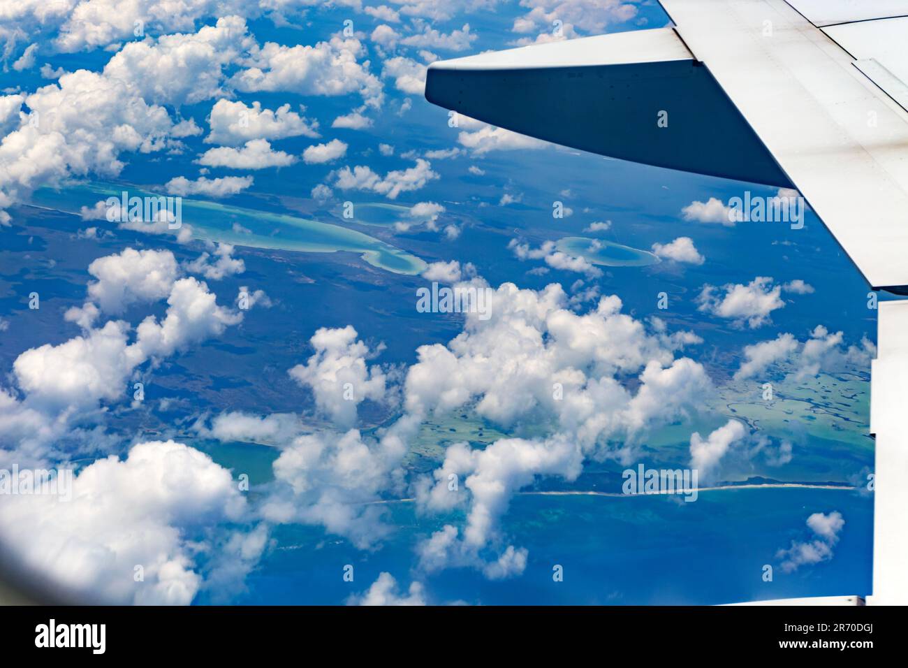 Oblique angle aerial view through plane window Laguna Chunyaxché ...