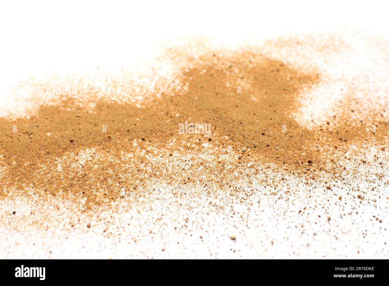 Pile of brown dust scattered on white background Stock Photo - Alamy