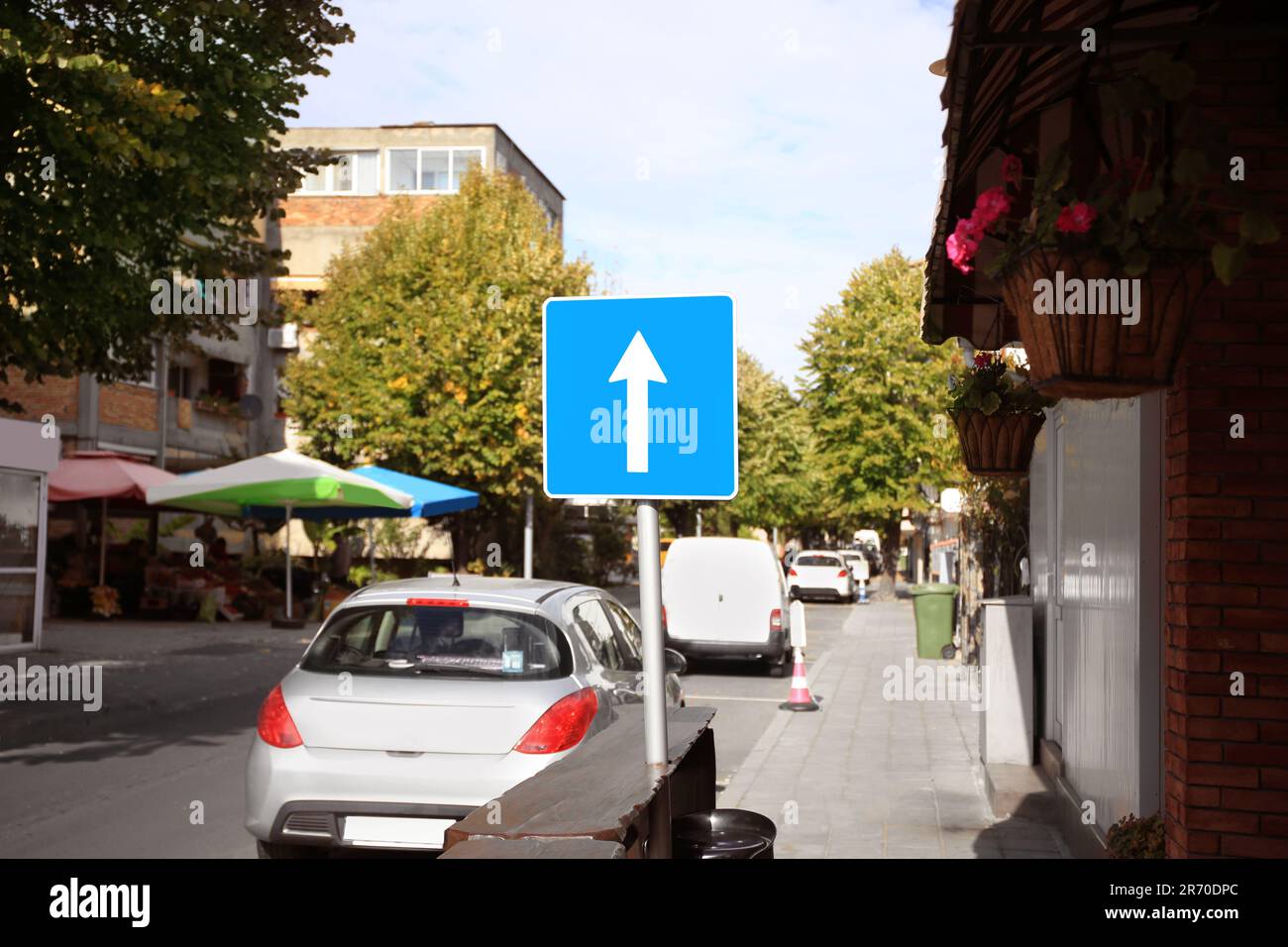 One Way Traffic sign near road with cars outdoors Stock Photo - Alamy