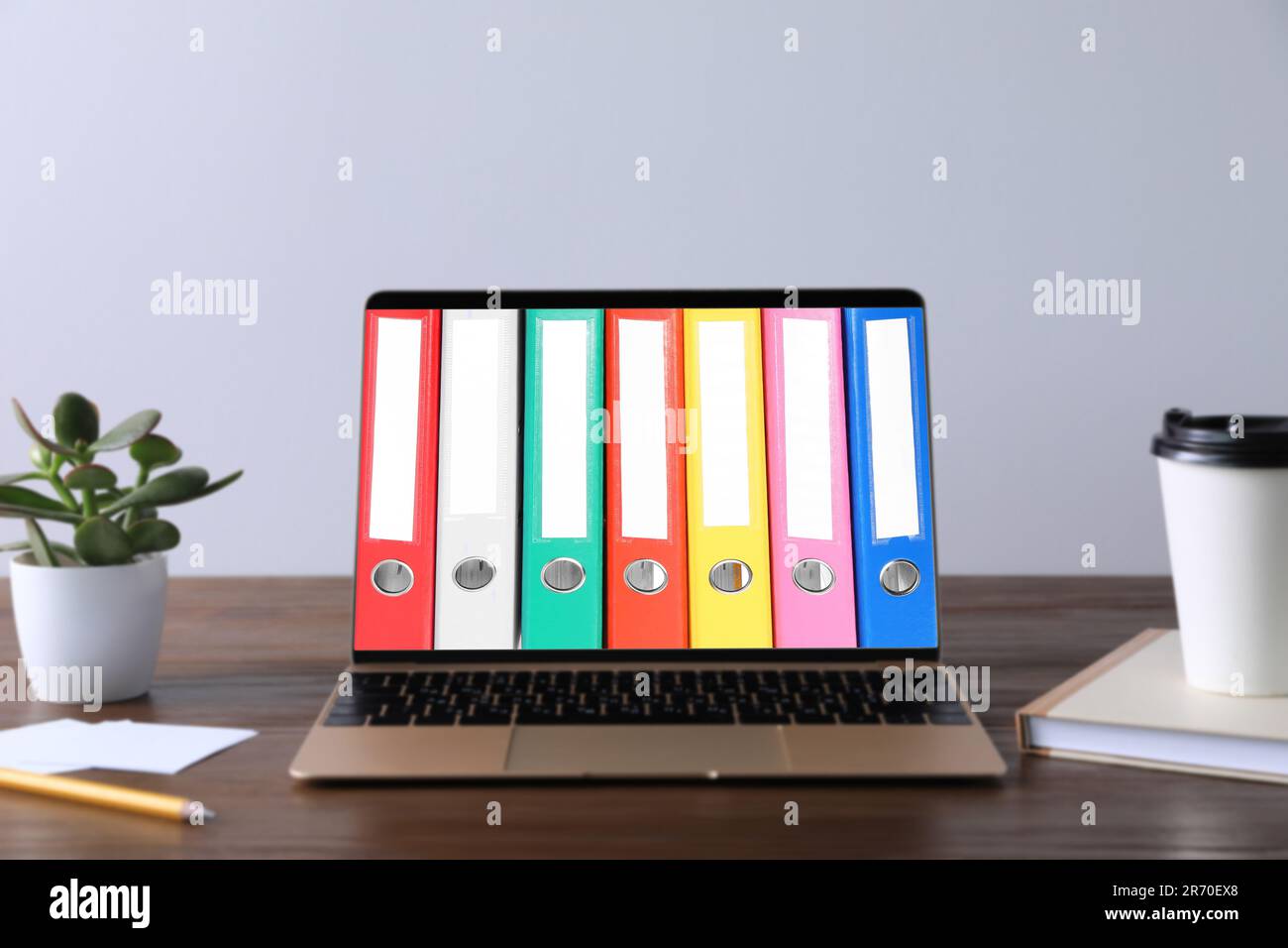 Store and organize information. Modern laptop with hardcover office ...