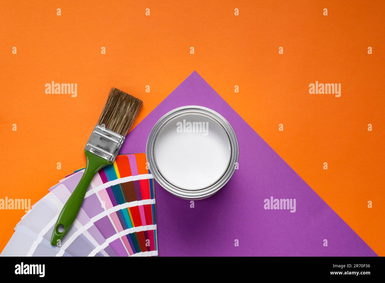 Can with white paint, color palette and brush on color background, flat ...