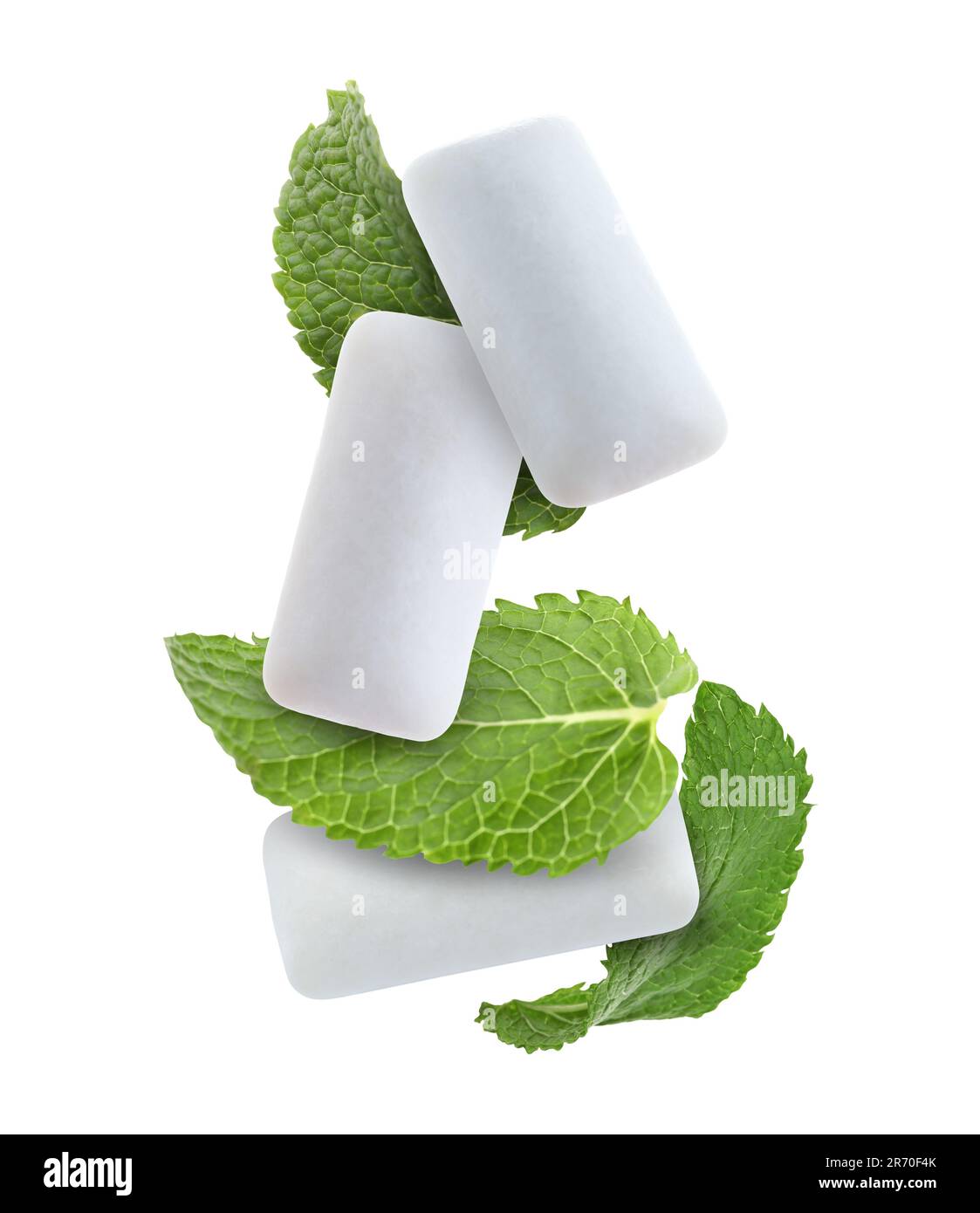 Fresh mint leaves and chewing gum pads falling on white background ...