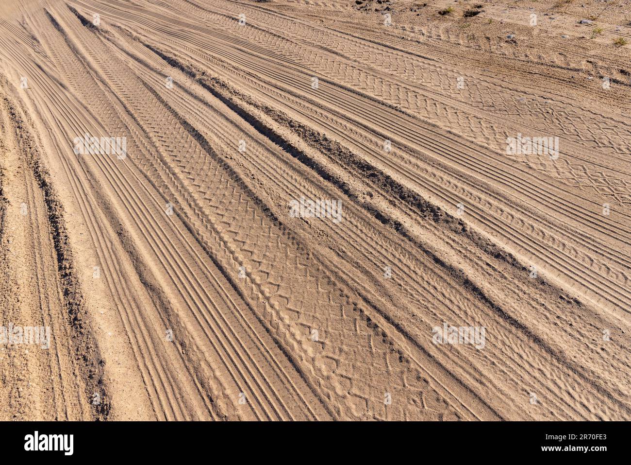 Rural road for cars and transport, ruts and traces of cars on a sandy ...