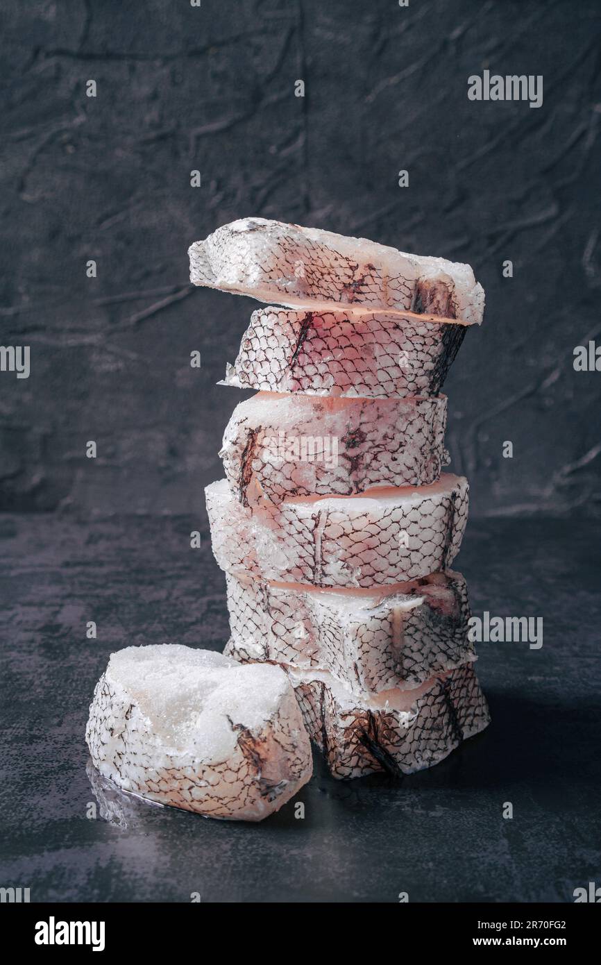 Pyramid of freshly frozen Macrourus fish. Gray background Stock Photo ...