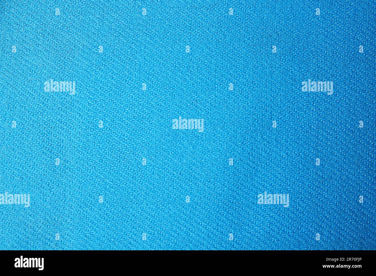 Light blue cloth with lint as background, top view. Before using fabric ...