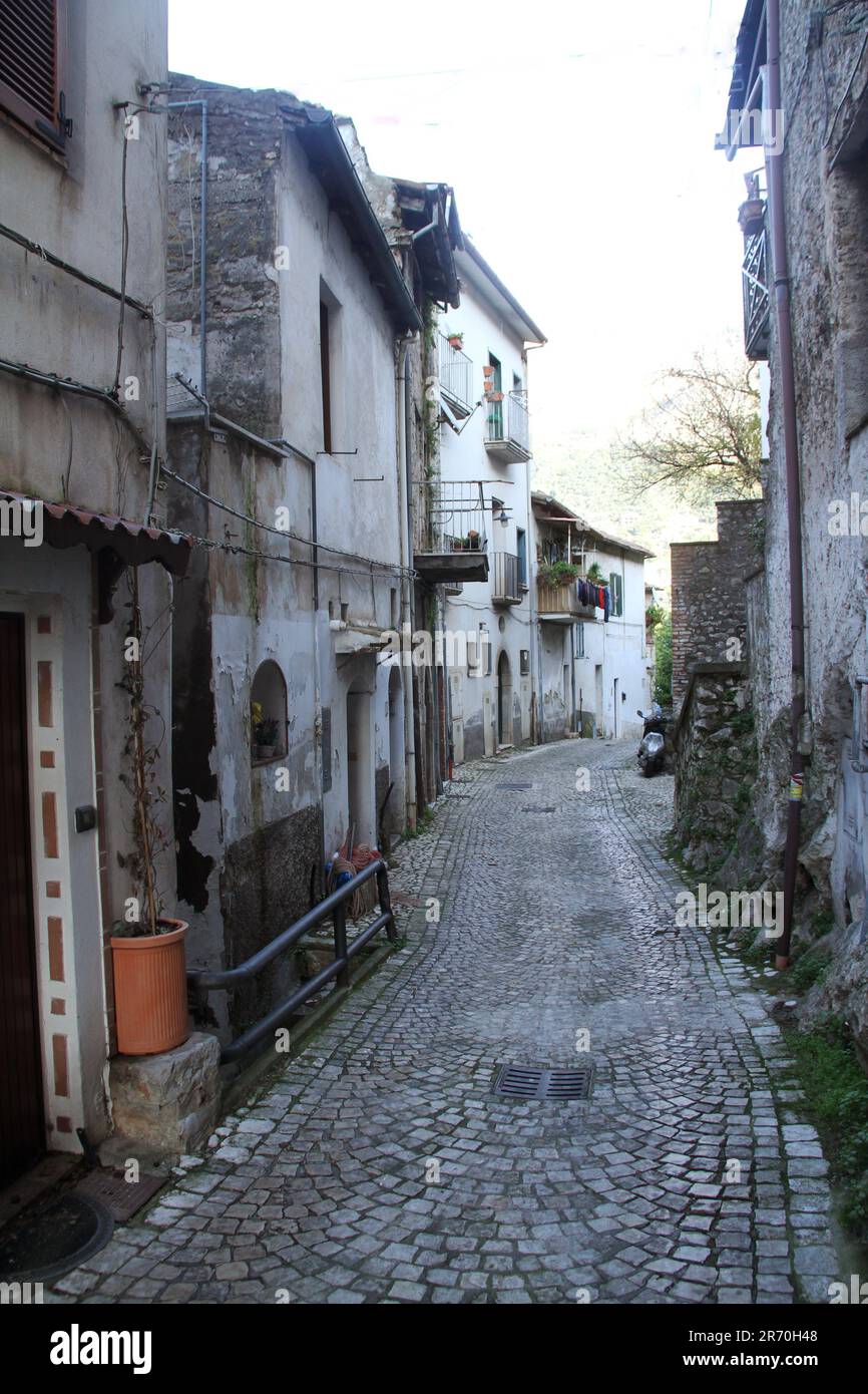 Itri, Italy. Narrow alleyway with cobblestone pavement and old stone ...