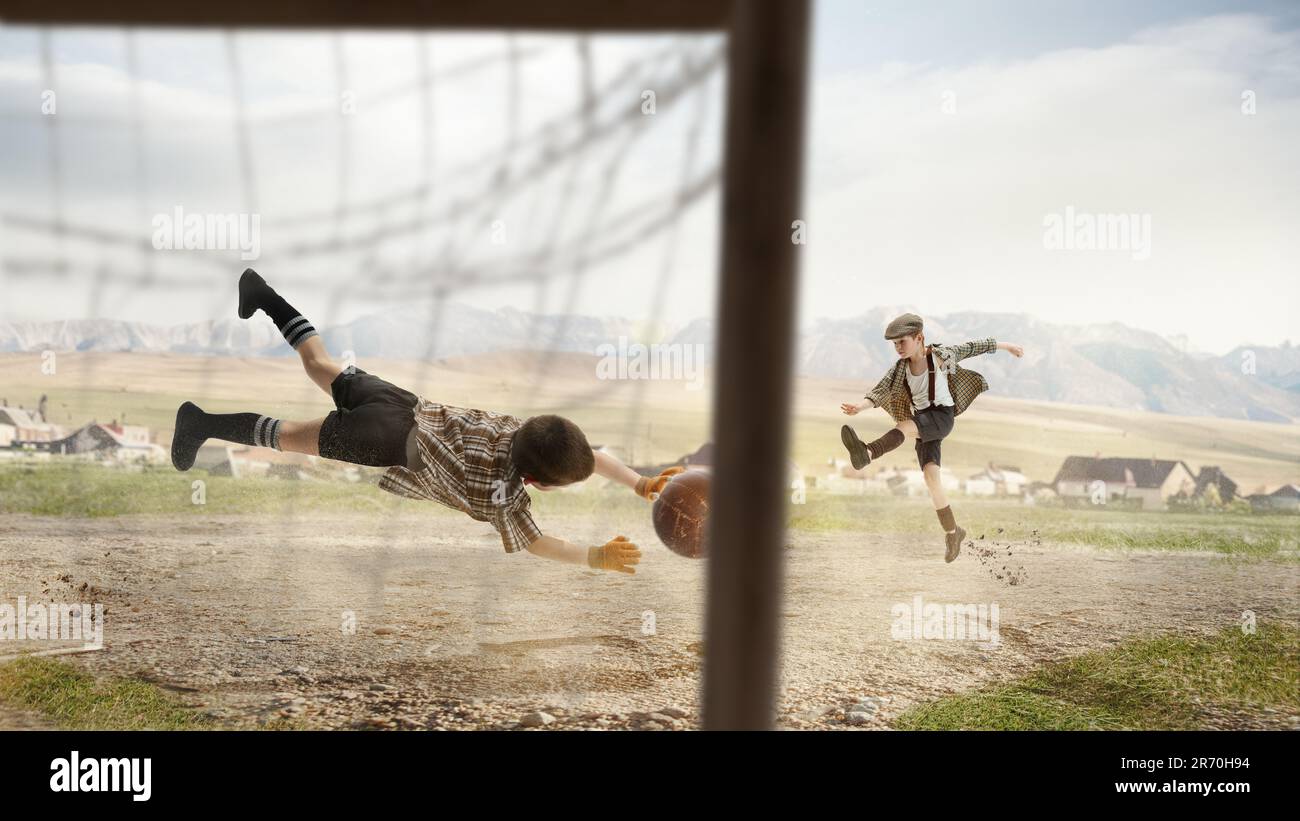 Two little boys, children in retro style clothes playing football ...