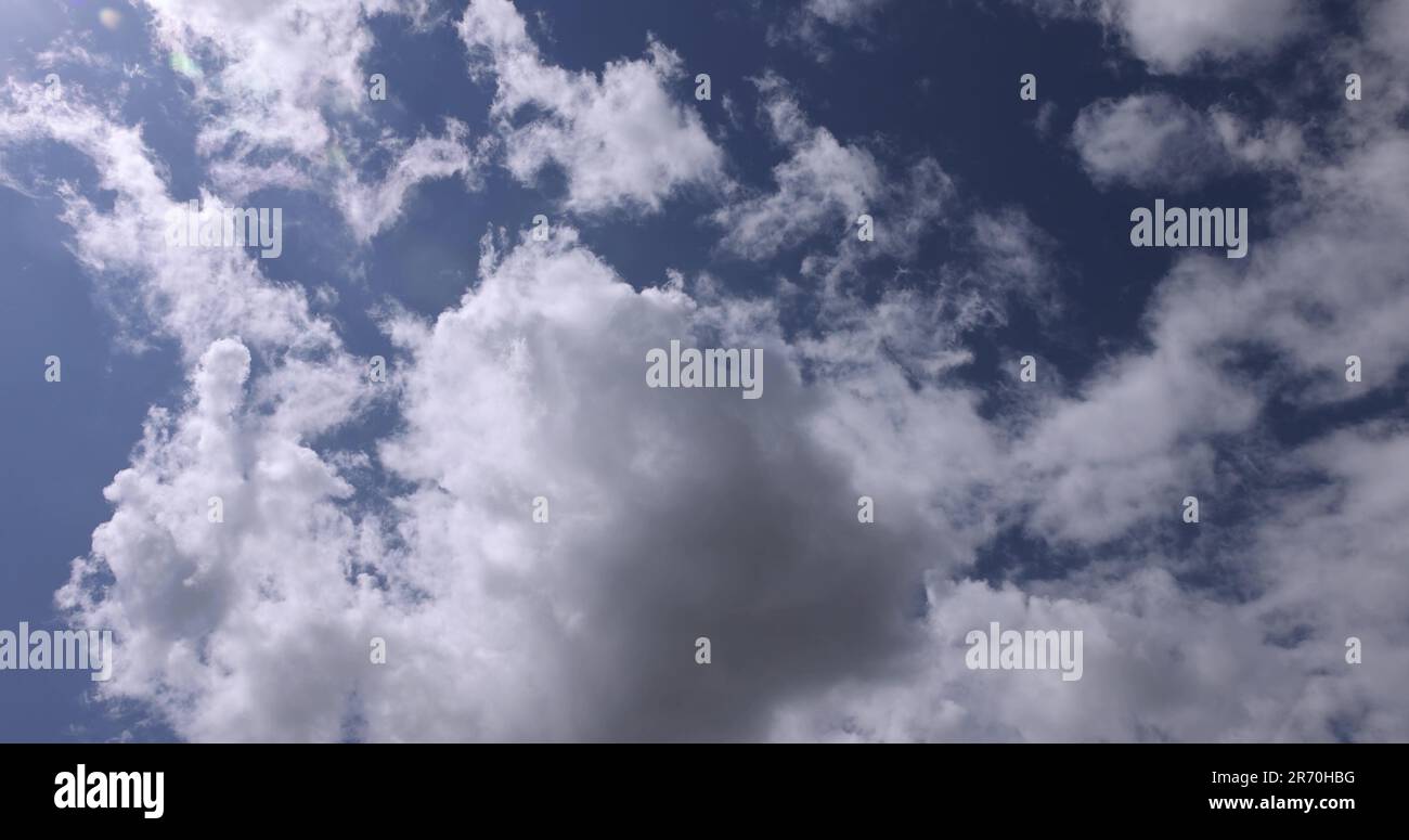 Clouds floating across the sky in the daytime, white clouds moving from ...