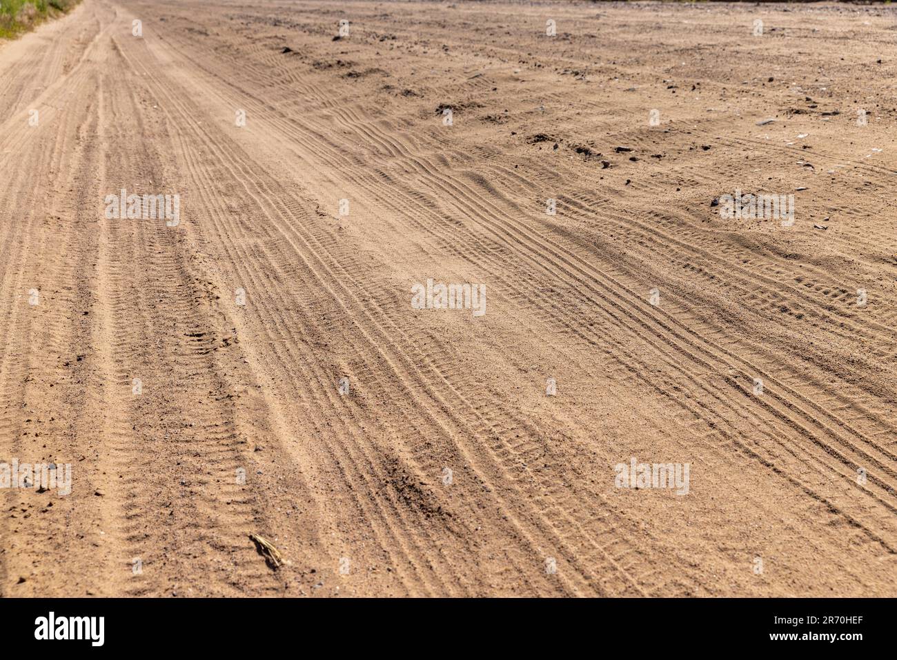 Rural road for cars and transport, ruts and traces of cars on a sandy ...