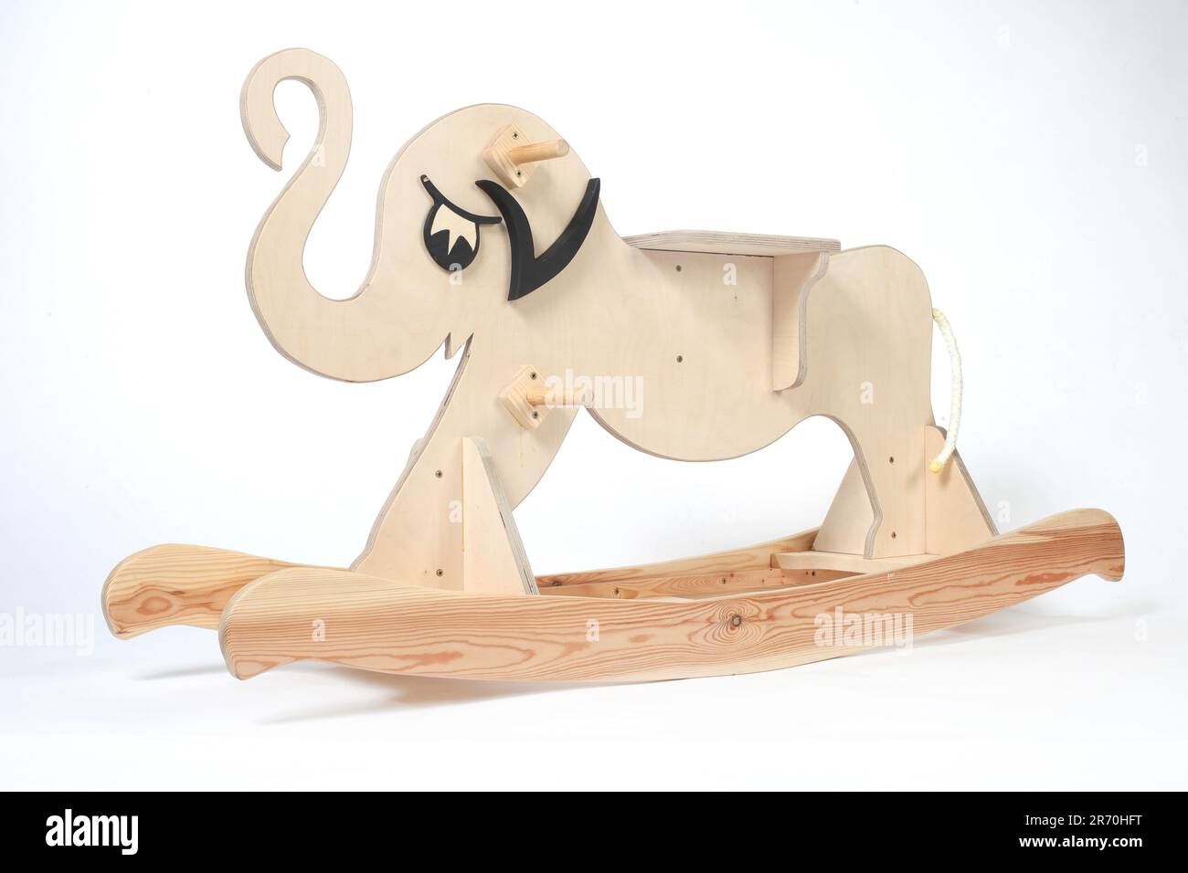 A wooden ride-on rocking elephant Stock Photo - Alamy