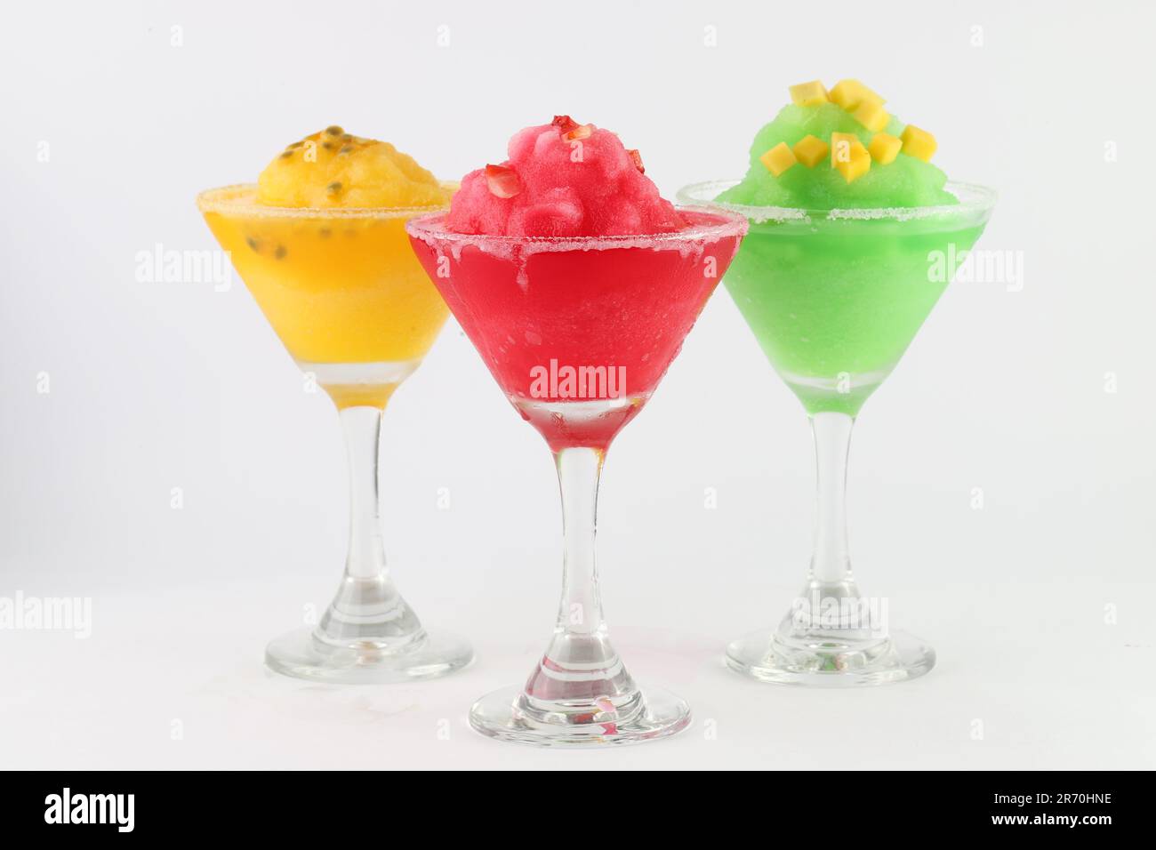 Three delightful martini glasses filled with different colored ...