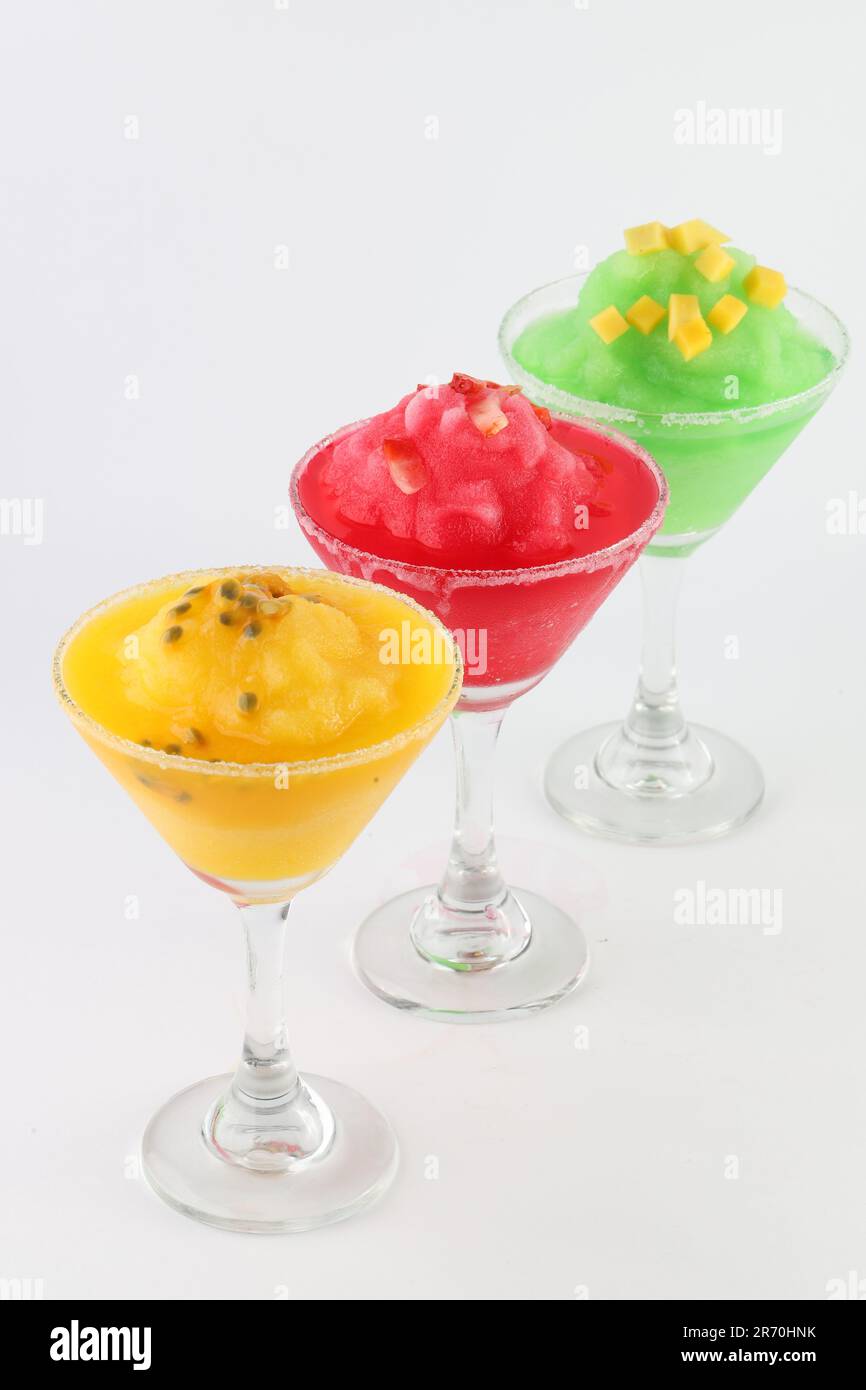 Three delightful martini glasses filled with different colored ...