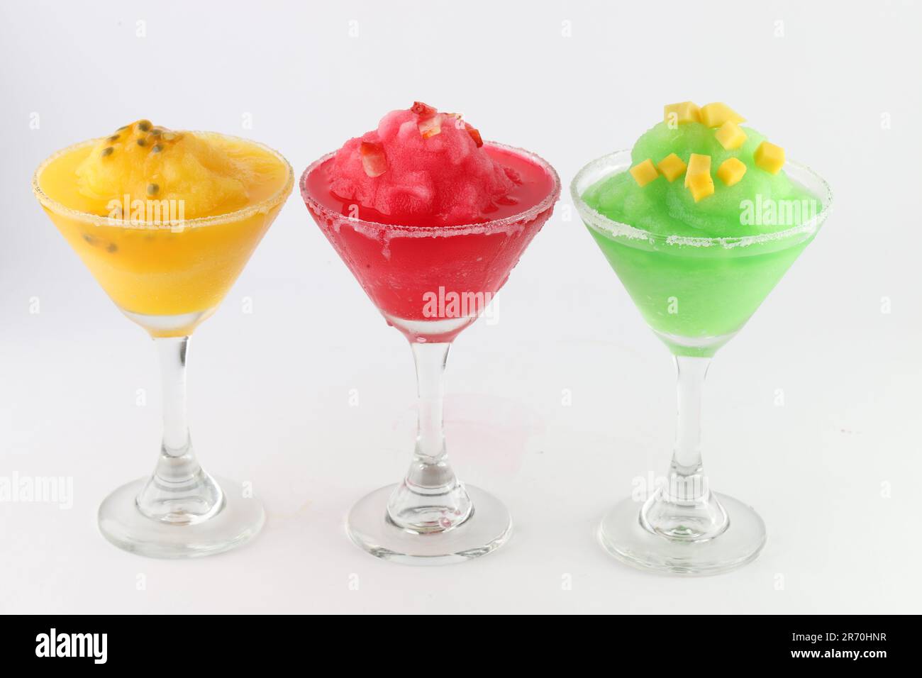 Three delightful martini glasses filled with different colored ...