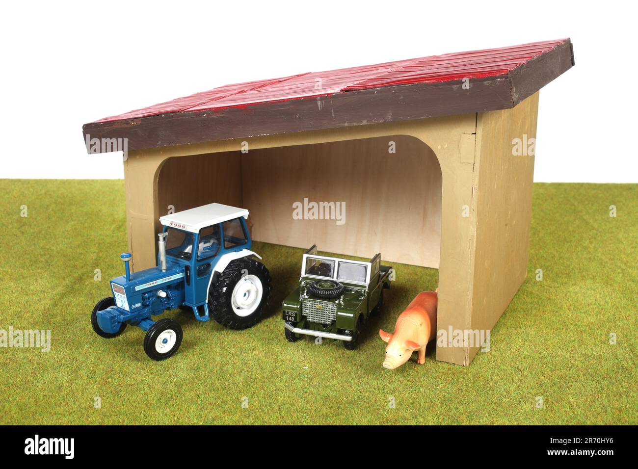 A wooden farmyard barn with tractor,Land Rover and pig Stock Photo - Alamy