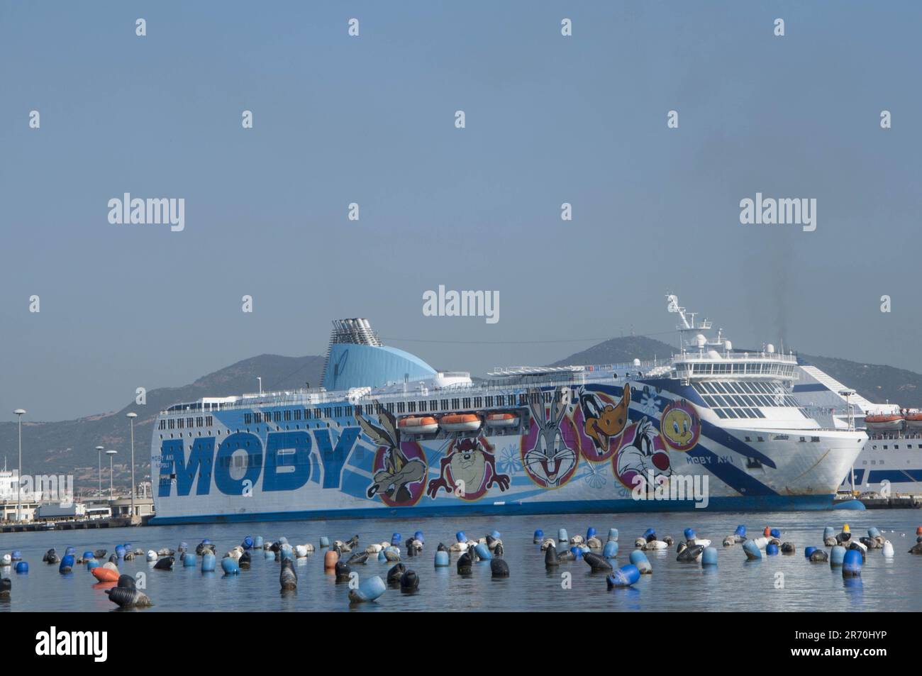 Ship Moby in a body of water in Olbia, Italy Stock Photo - Alamy