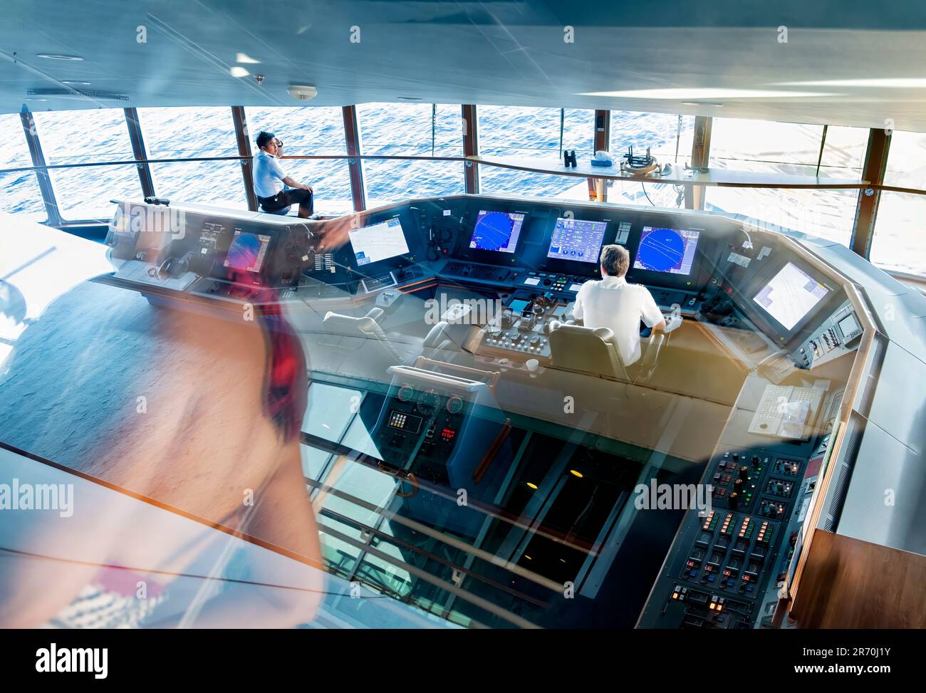 A view of the bridge of a cruise ship through an observation window ...