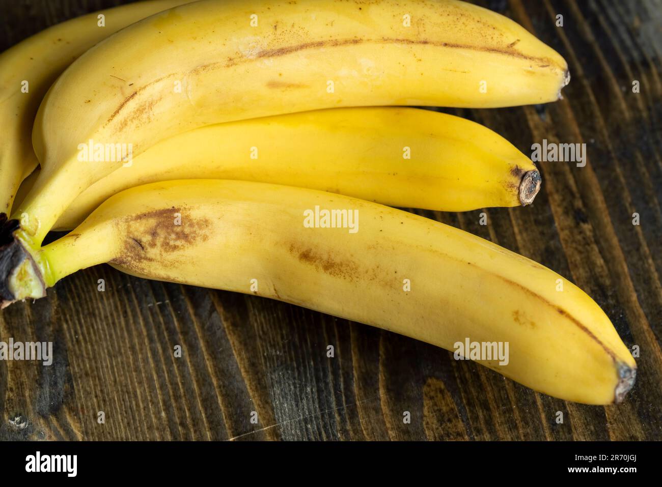 Ripe yellow bananas on the table, a bunch of ripe delicious bananas on ...